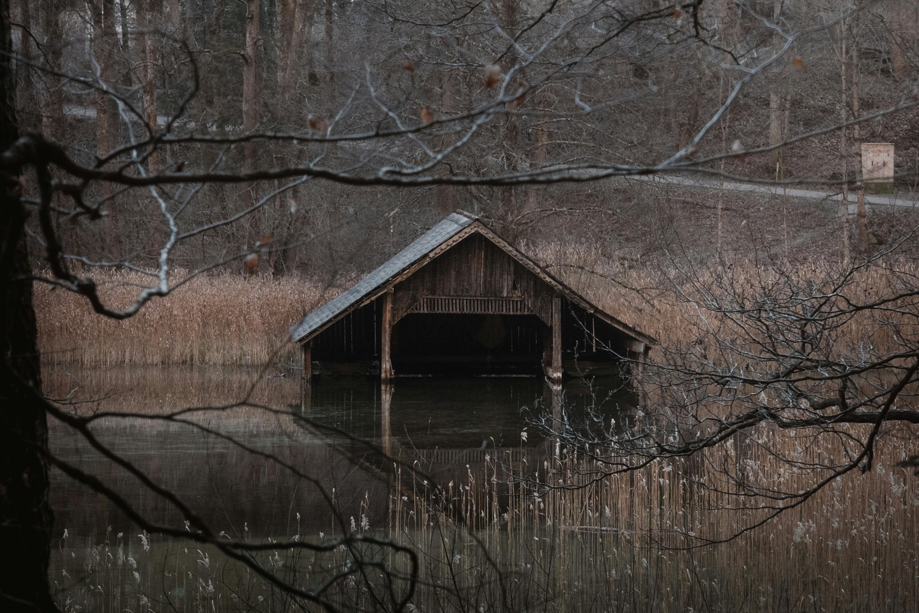 Rustic Boathouse by a Serene Winter Lake · Free Stock Photo
