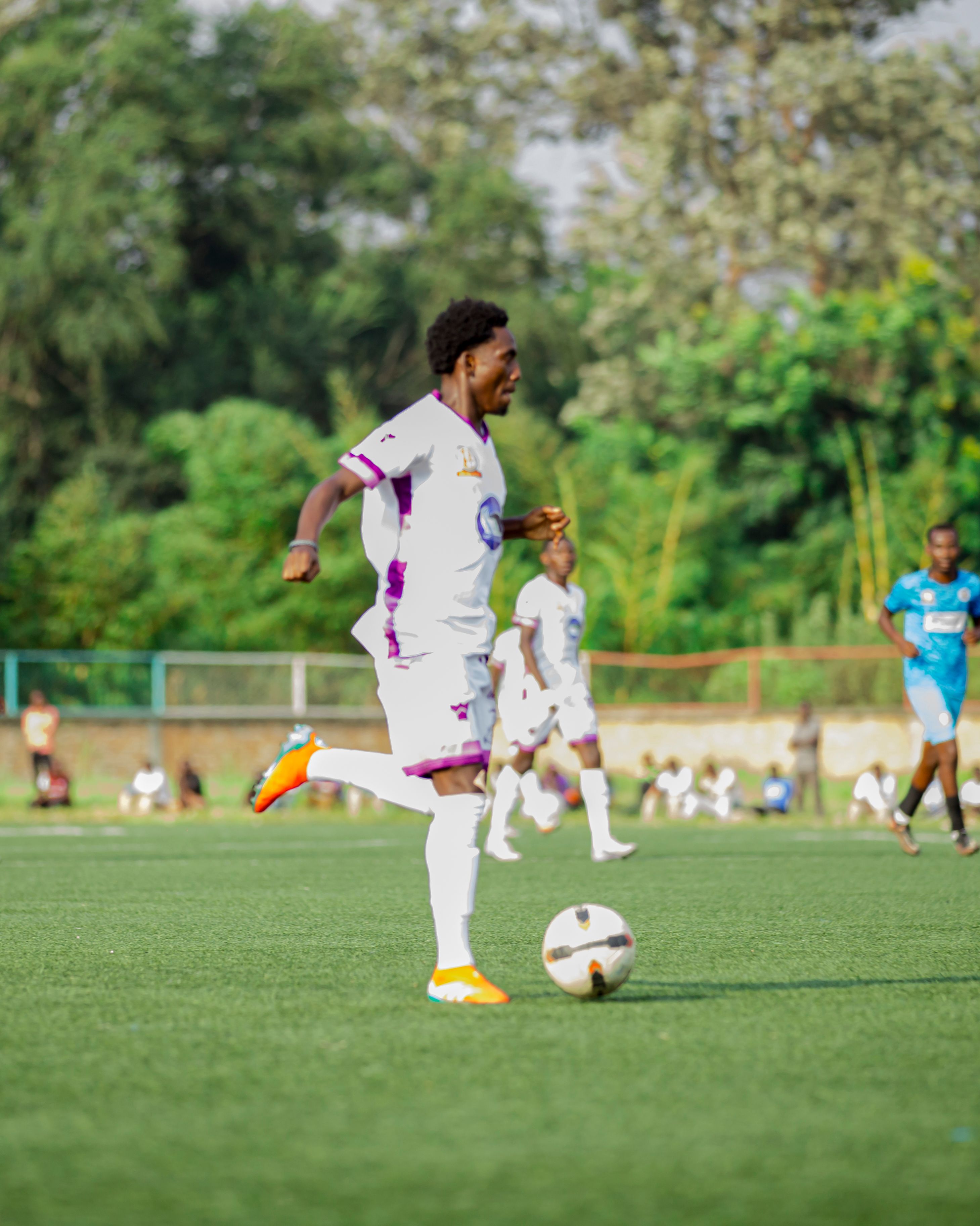 Action Shot of Soccer Player in Mid-Game · Free Stock Photo