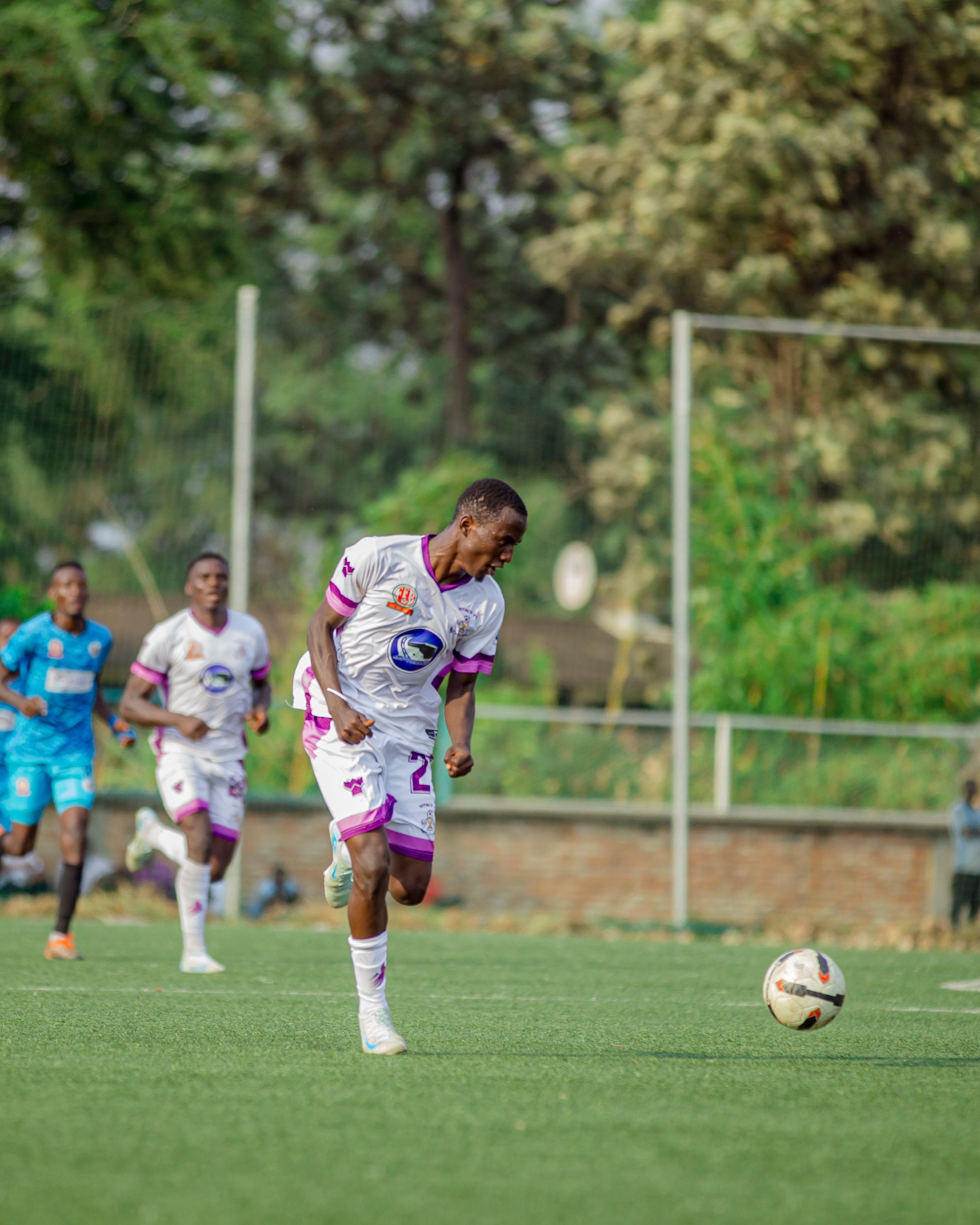 Dynamic Soccer Action on Green Field · Free Stock Photo