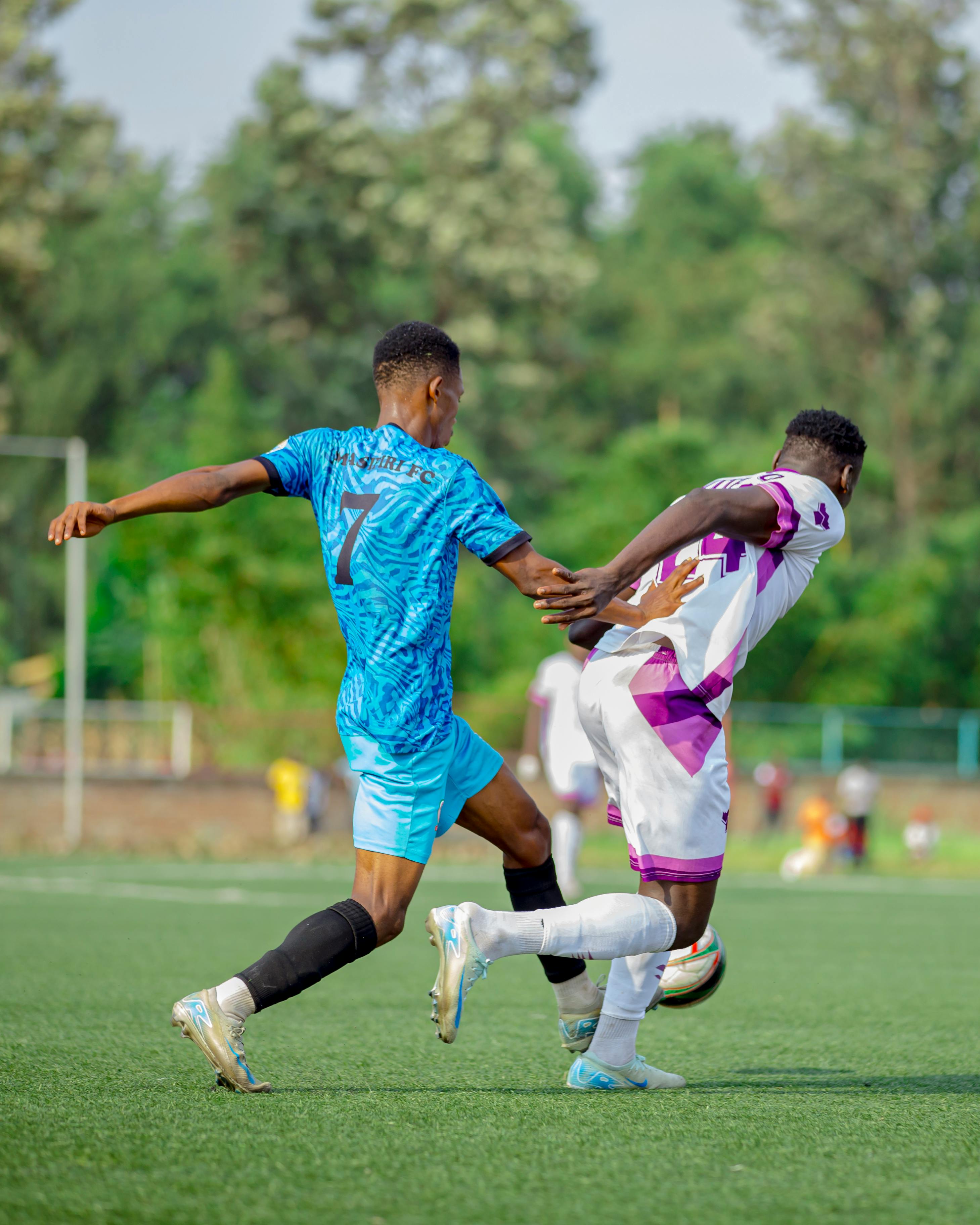 Intense Soccer Match on Outdoor Field · Free Stock Photo