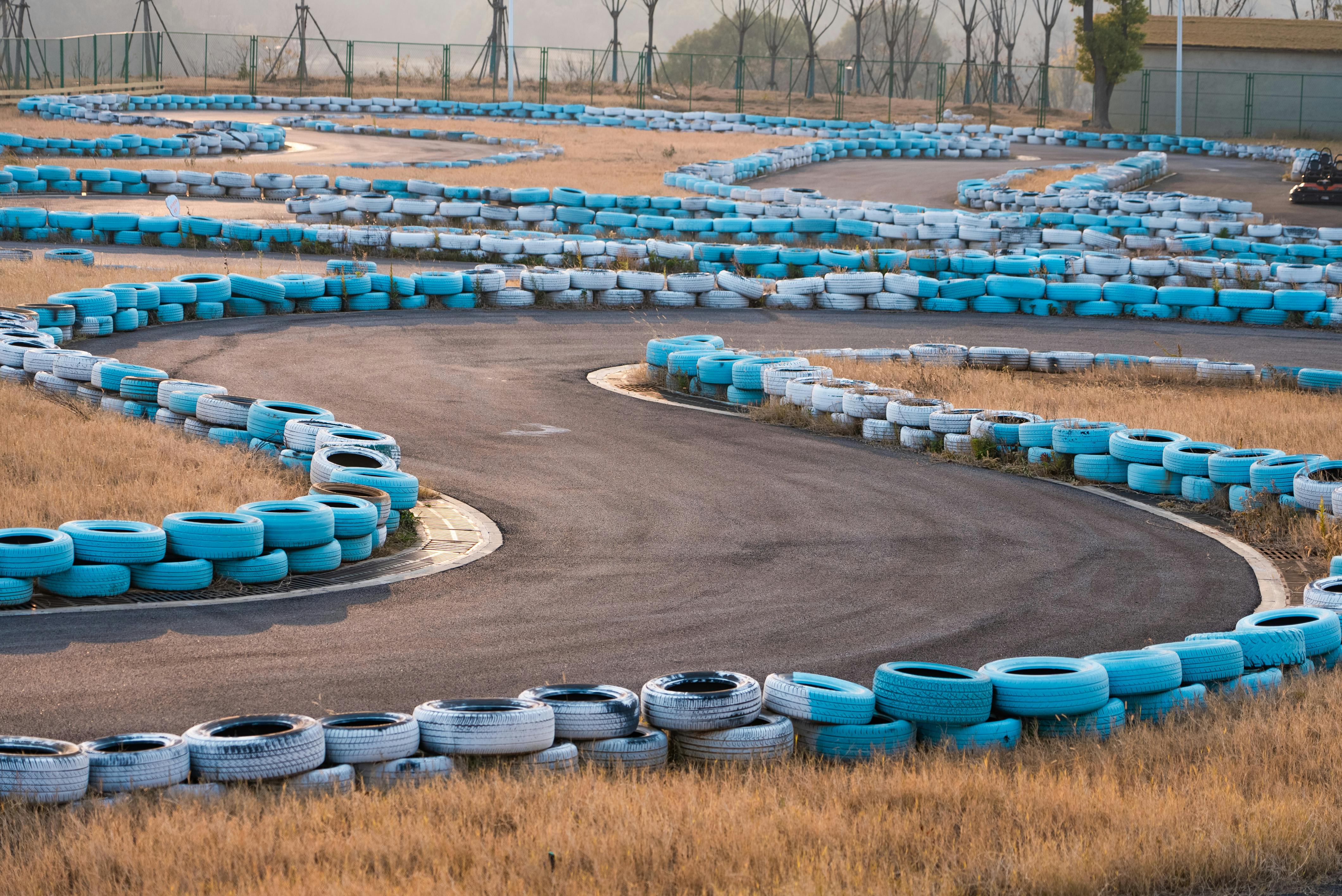 Outdoor Race Track with Colorful Tire Barriers · Free Stock Photo