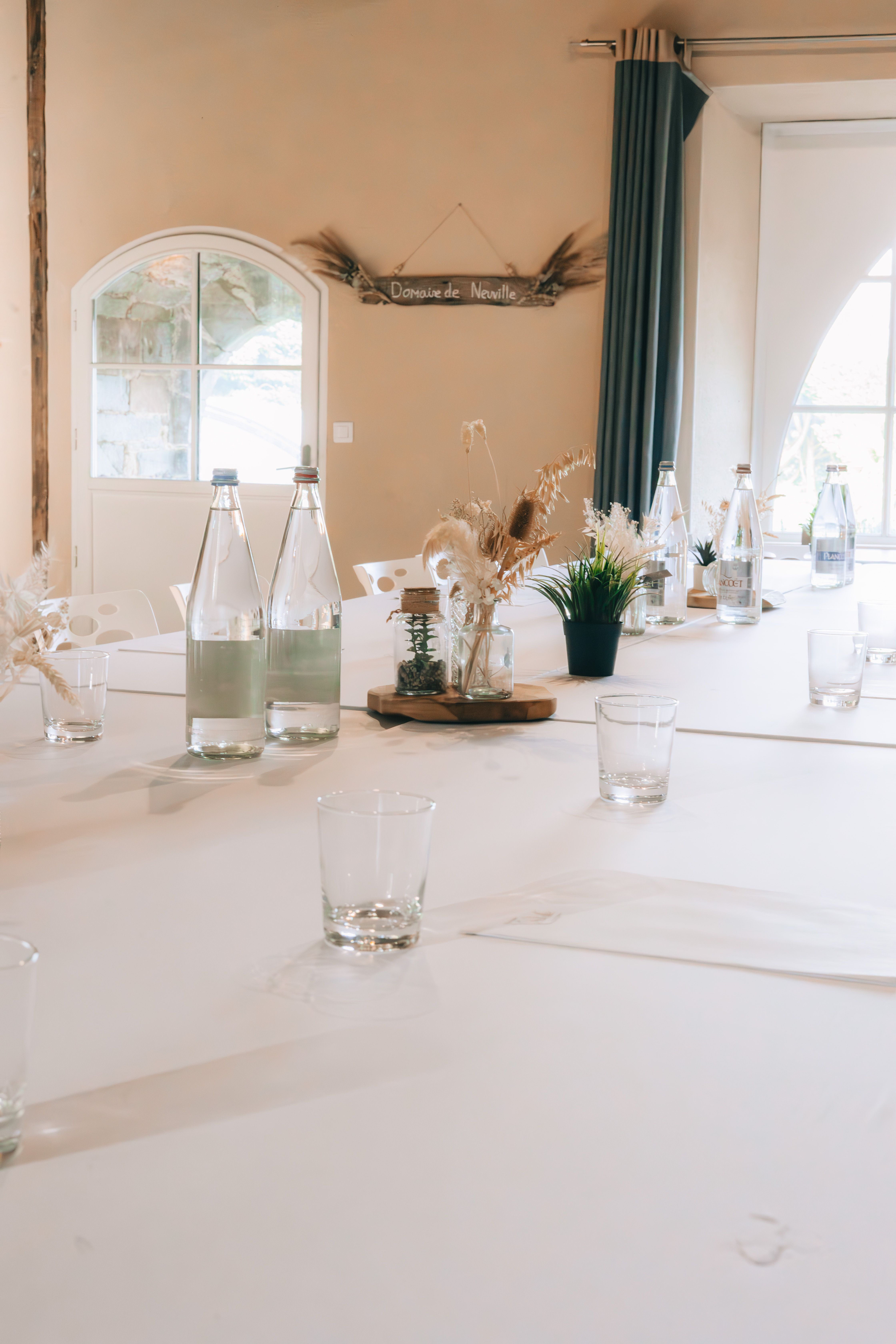 Elegant Conference Room Setup with Glass Bottles · Free Stock Photo