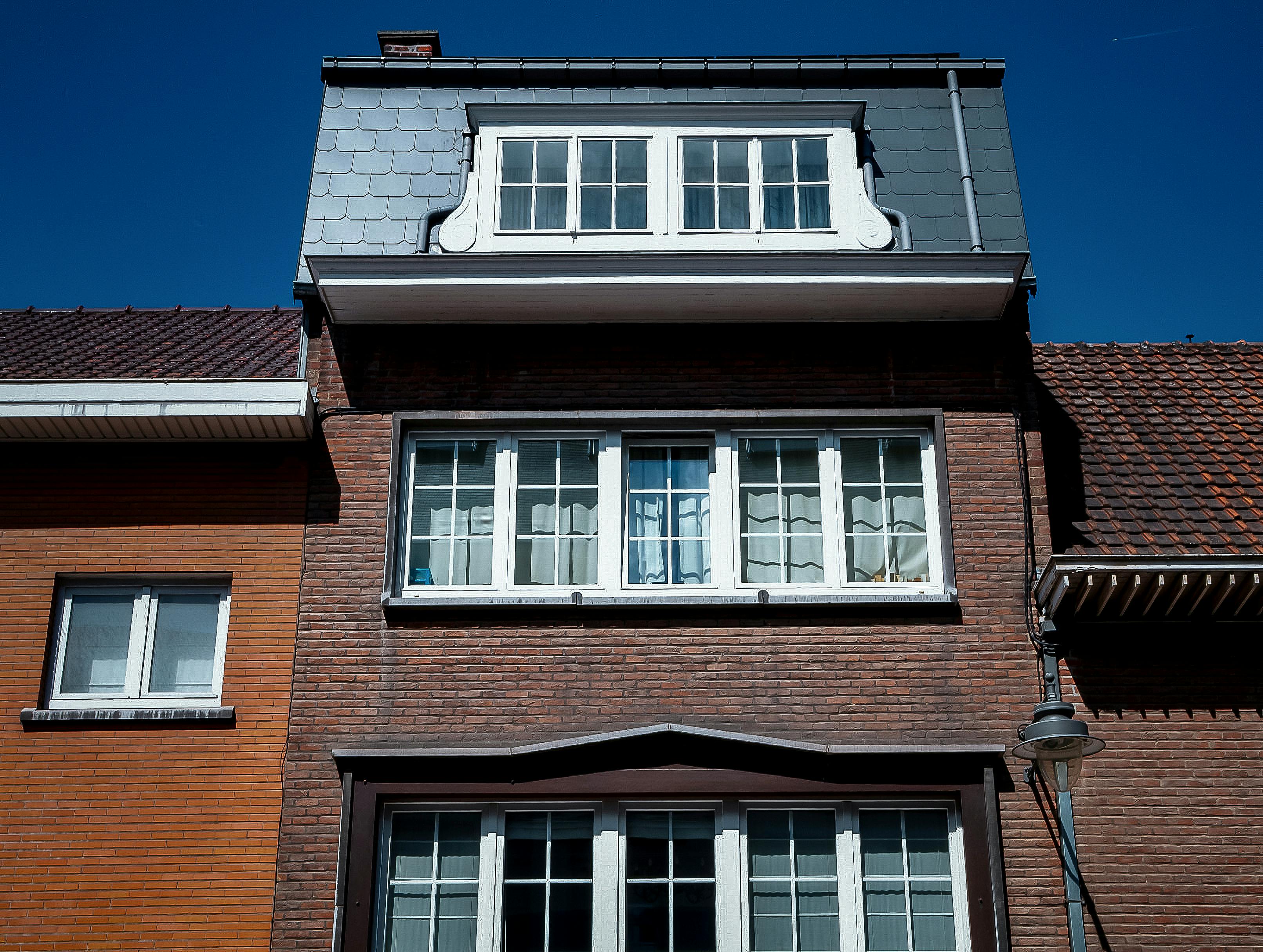 Brick House Facade with Dormer Windows · Free Stock Photo