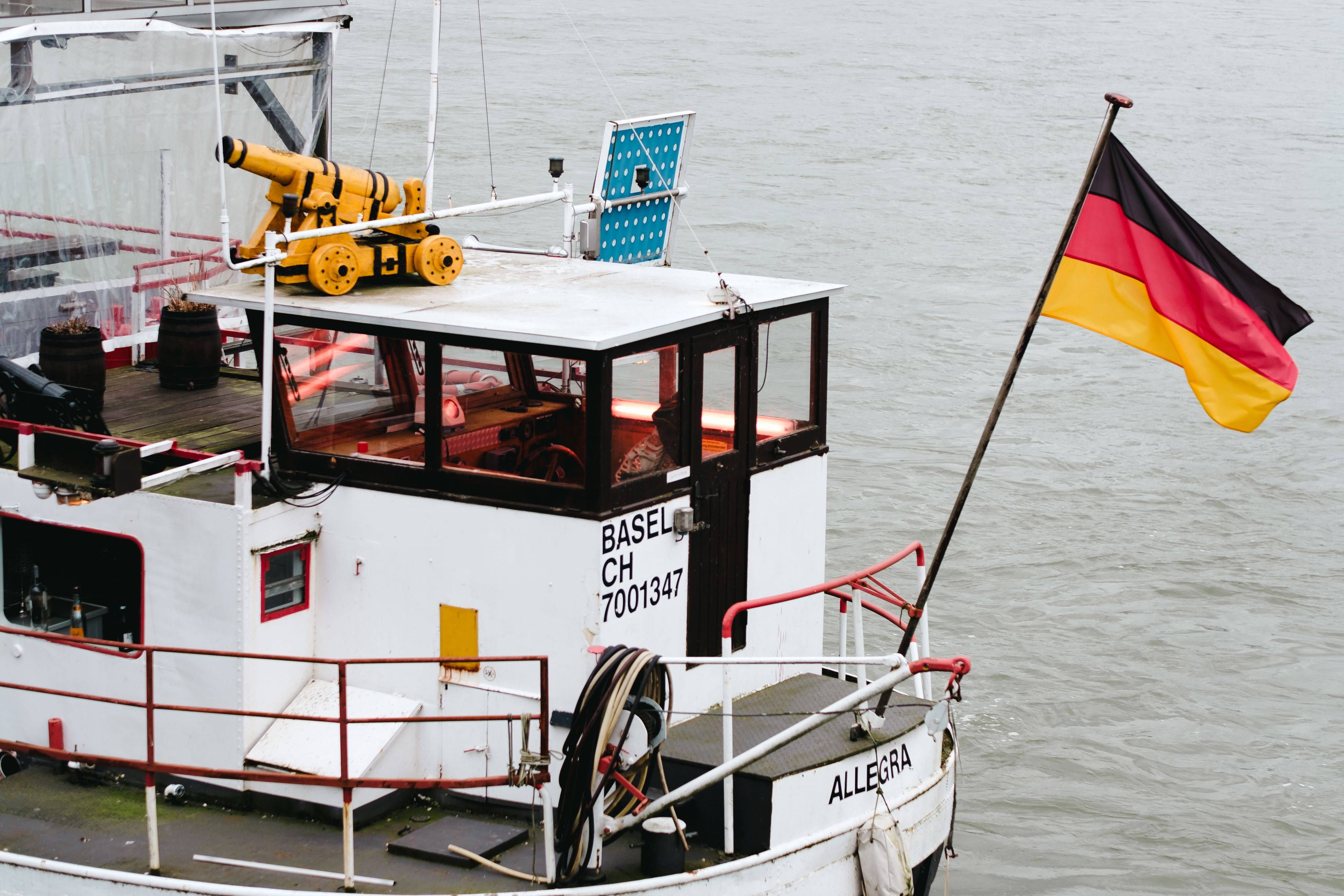 German Flagged Boat on Rhine River in Düsseldorf · Free Stock Photo