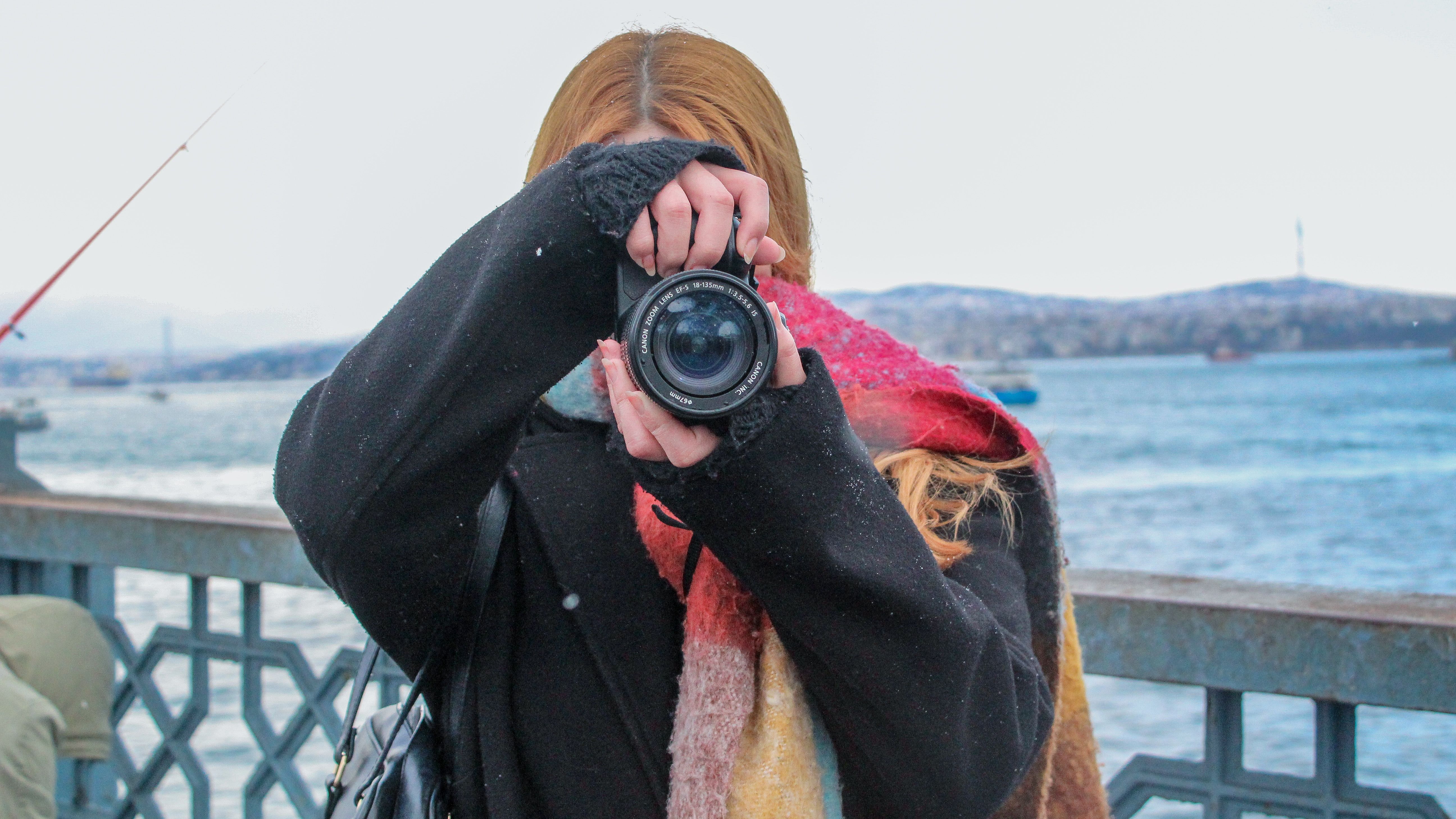 Photographer in Winter by Scenic Waterfront · Free Stock Photo