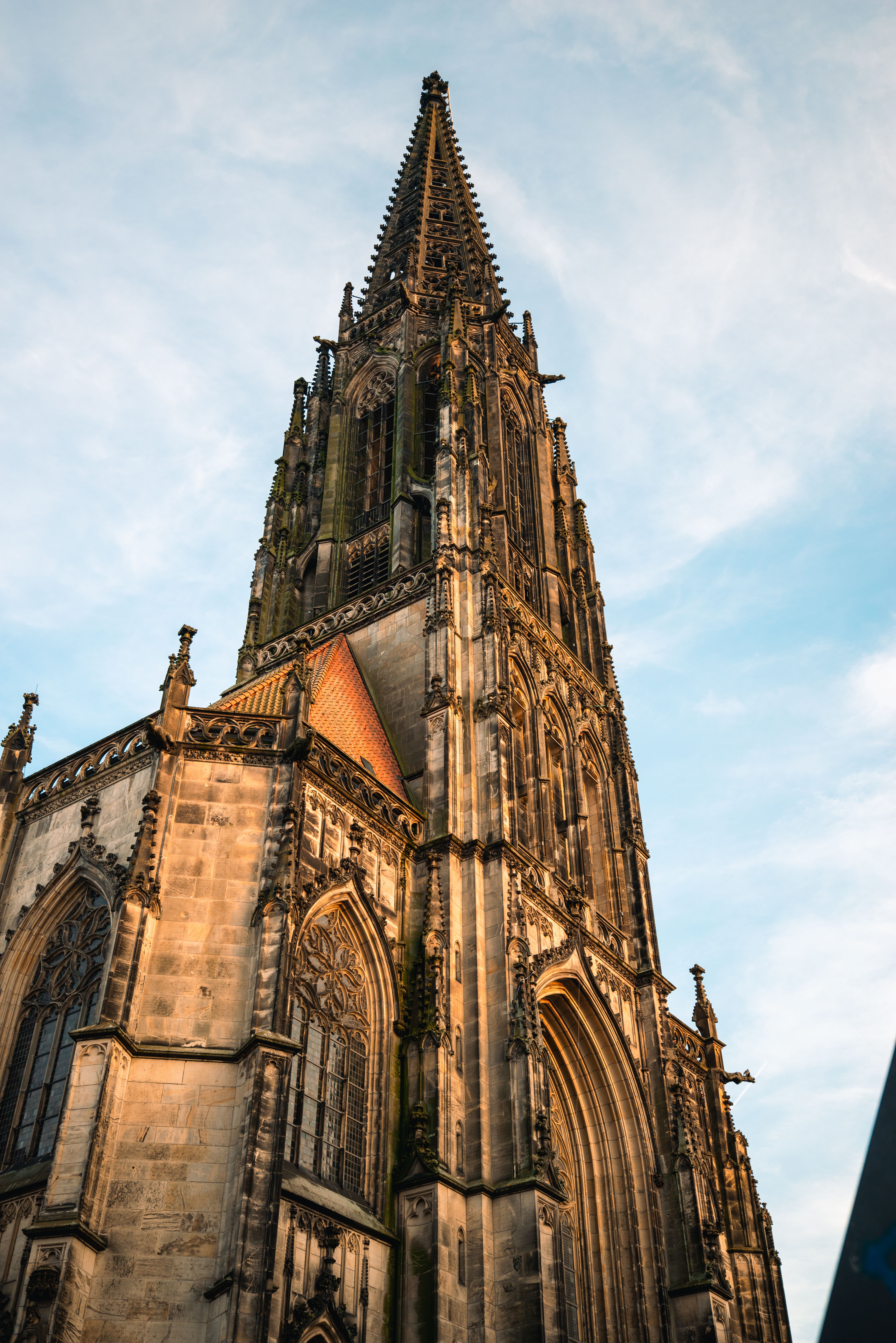 Stunning Gothic Cathedral Spire Against Blue Sky · Free Stock Photo