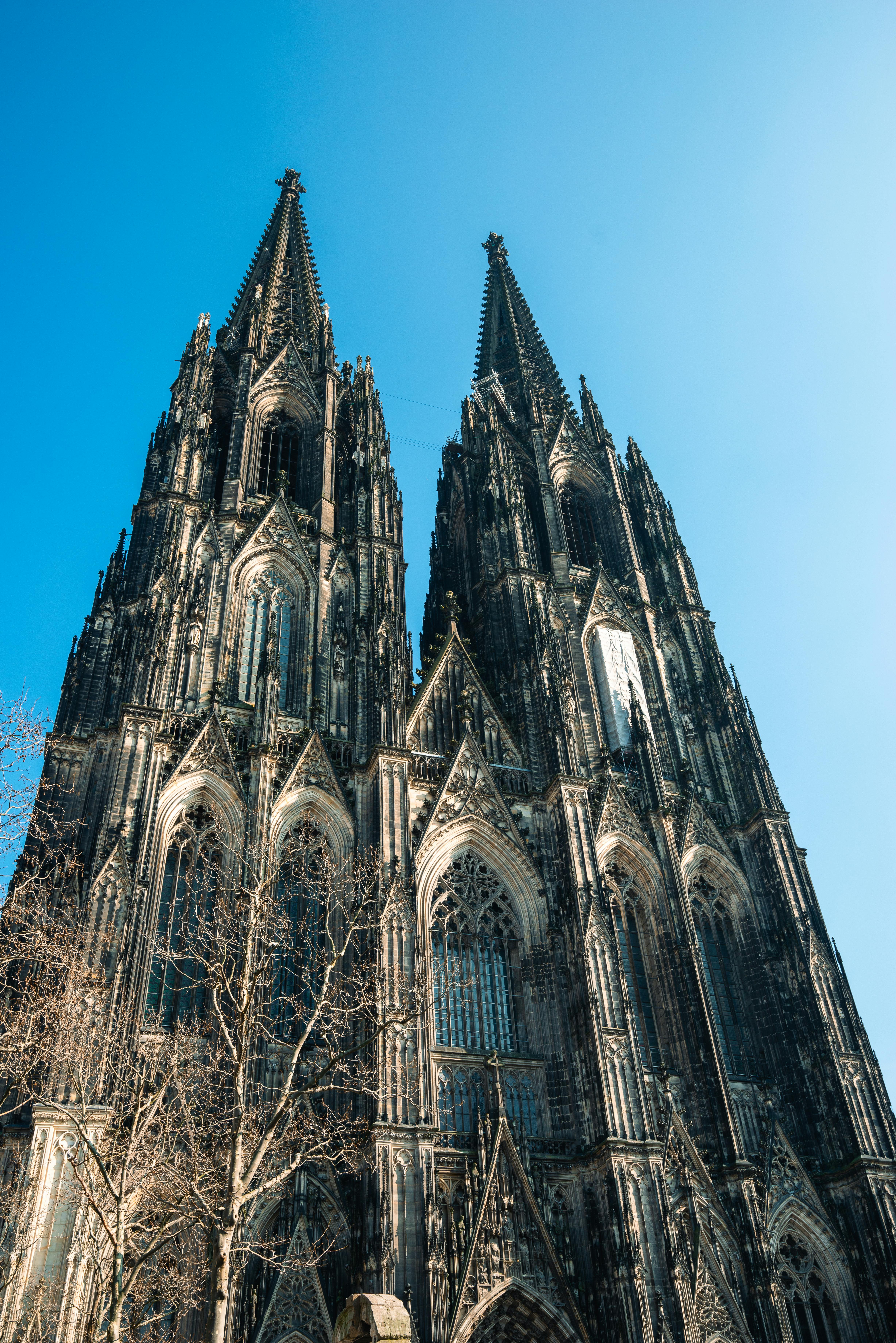 Gothic Spires of Cologne Cathedral under Blue Sky · Free Stock Photo