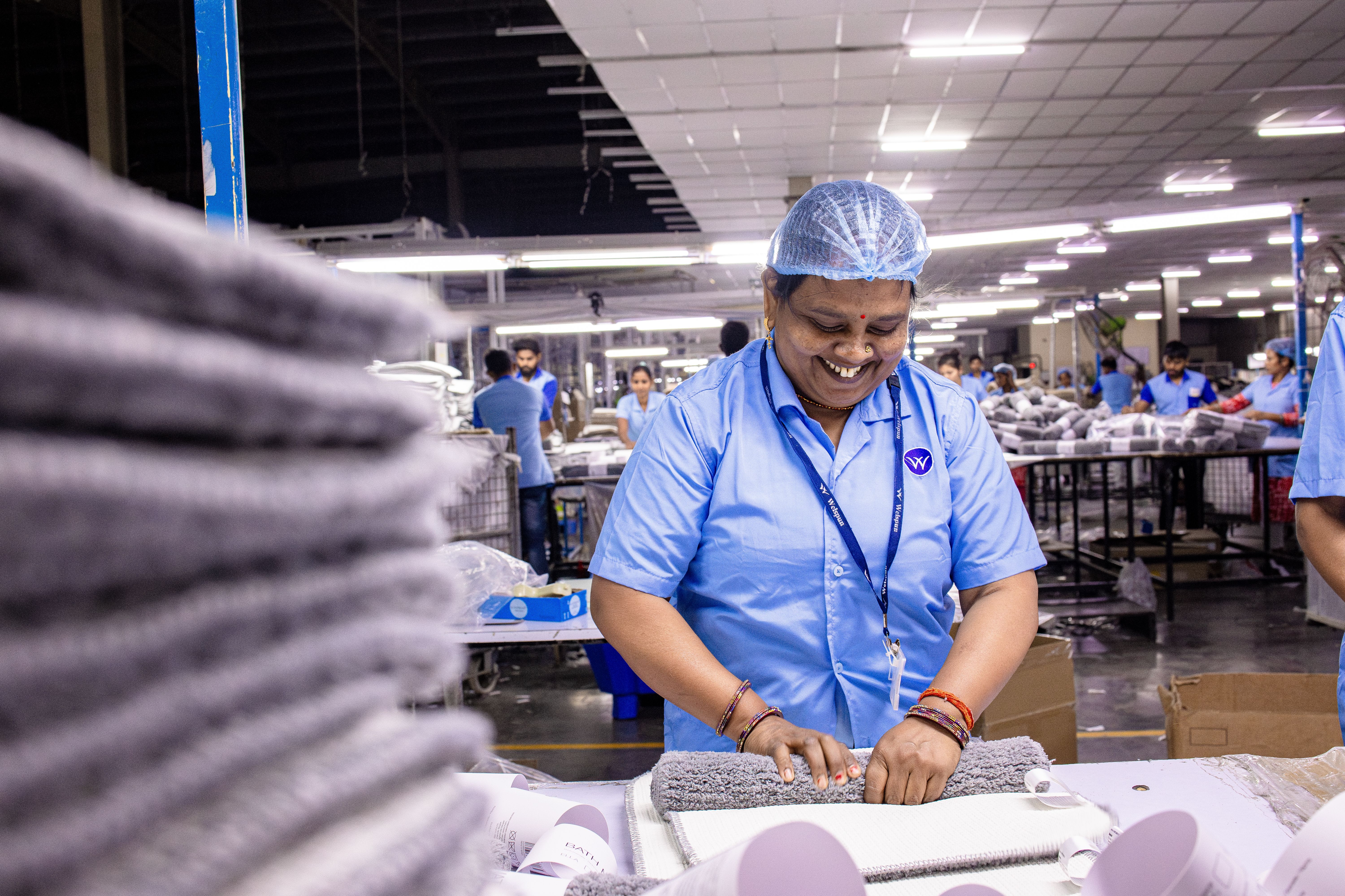 Happy Textile Factory Worker Assembling Products · Free Stock Photo