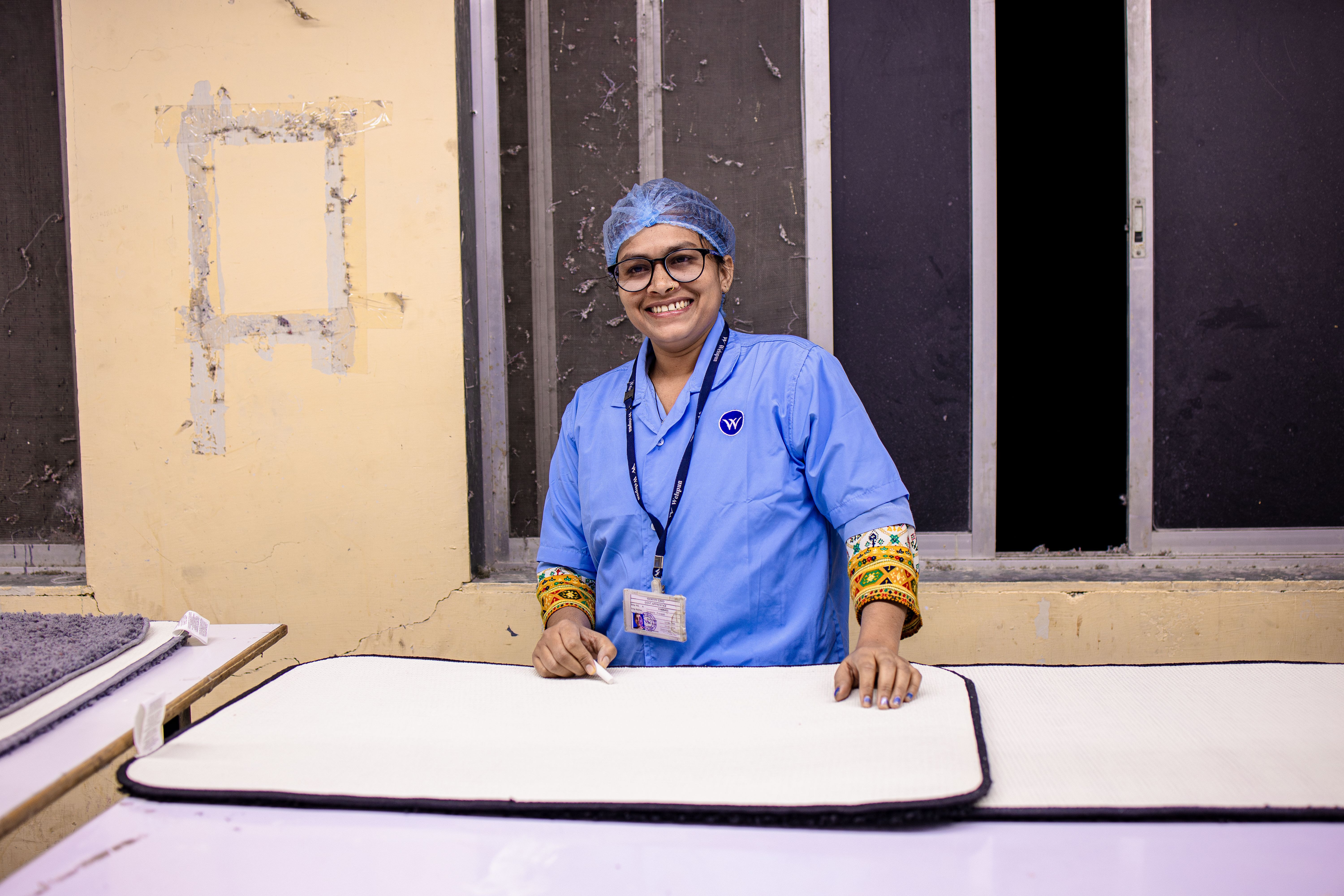 Smiling Healthcare Worker in Hospital Setting · Free Stock Photo