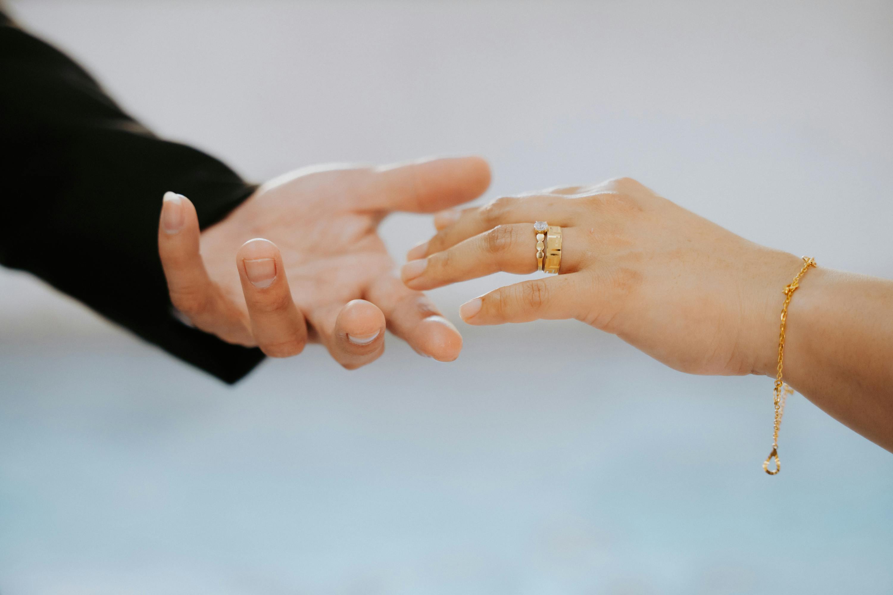 Romantic hand reach with elegant jewelry · Free Stock Photo