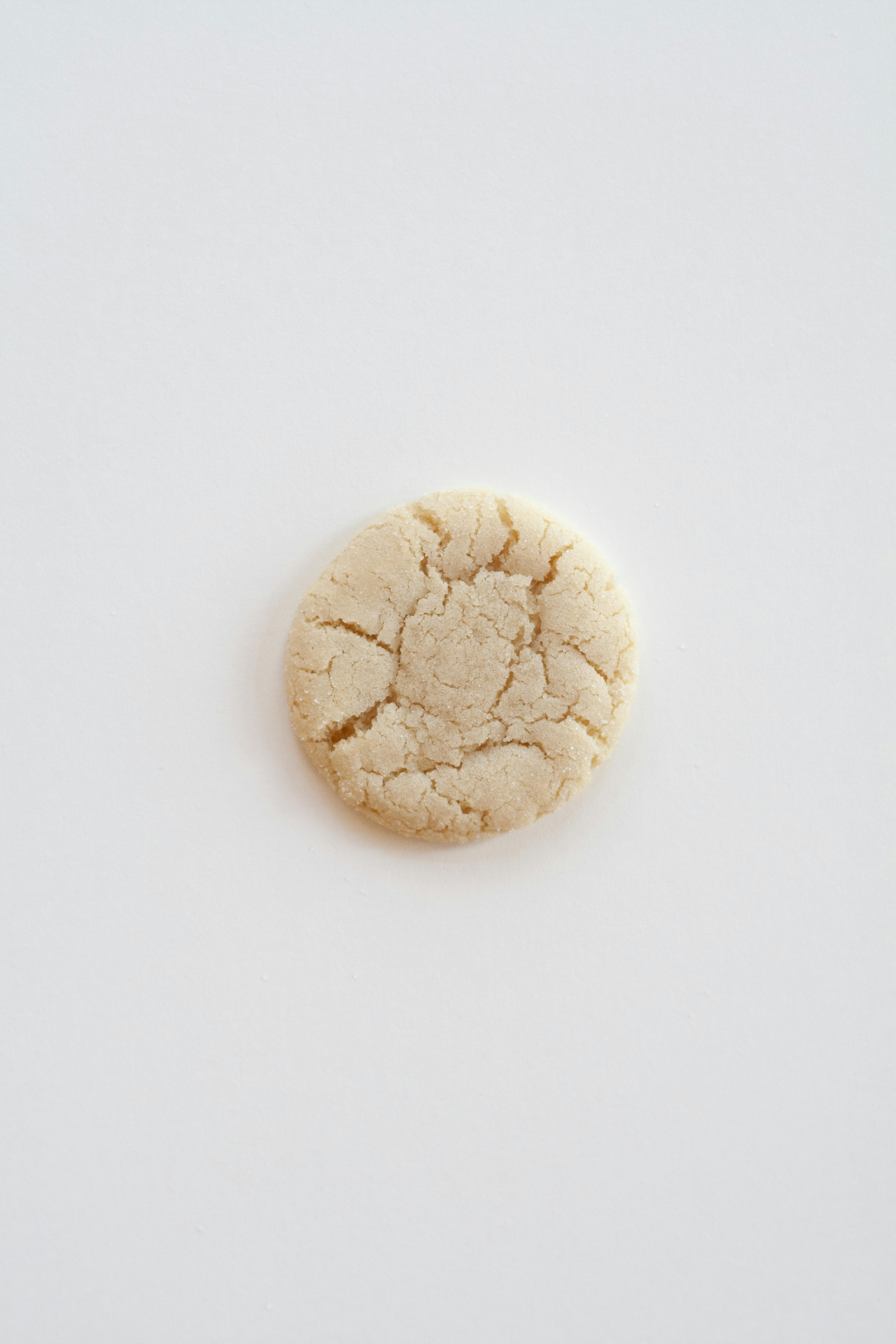 Minimalist Single Sugar Cookie on White · Free Stock Photo
