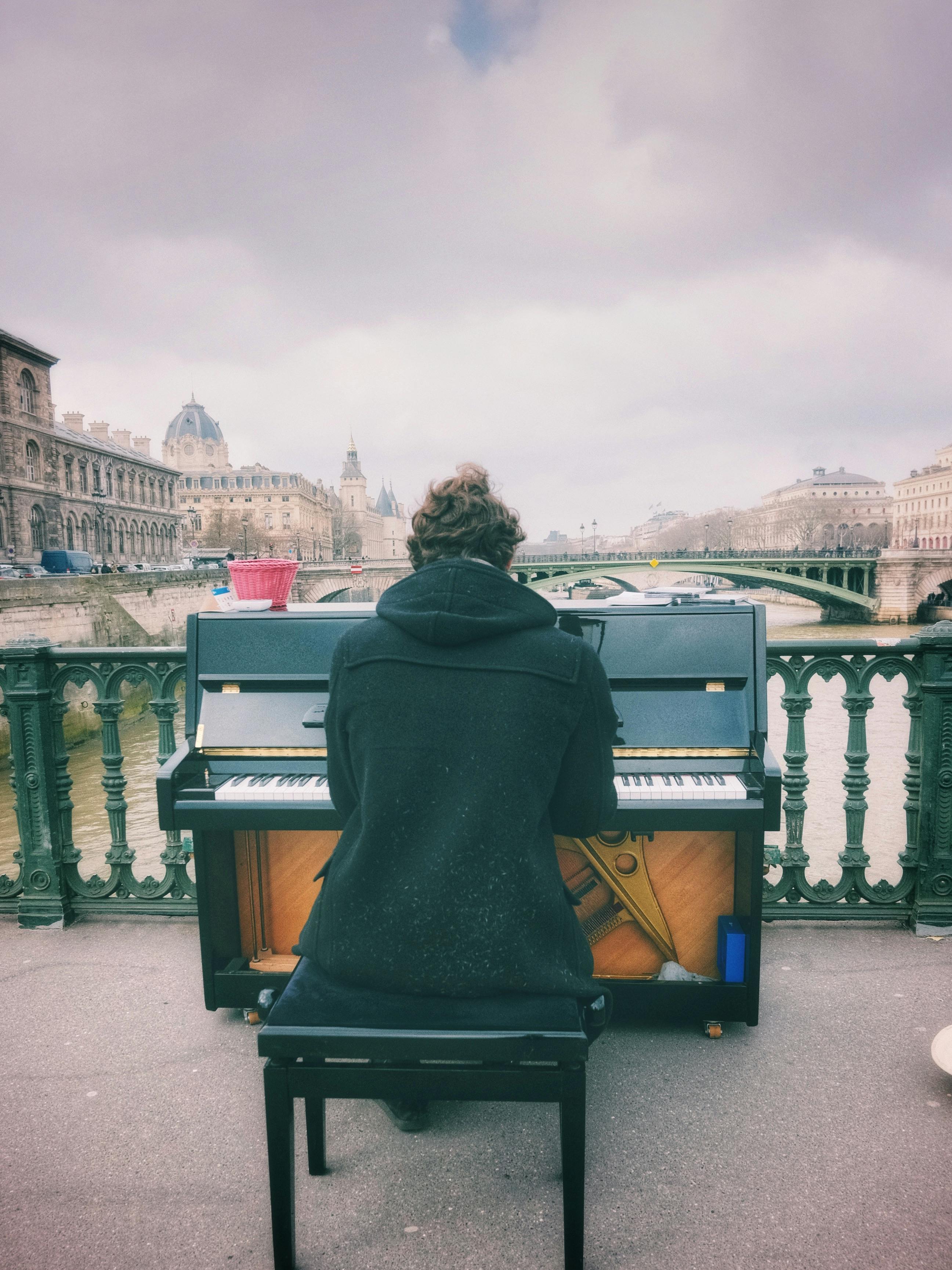 Street Pianist Playing by Seine River in Paris · Free Stock Photo