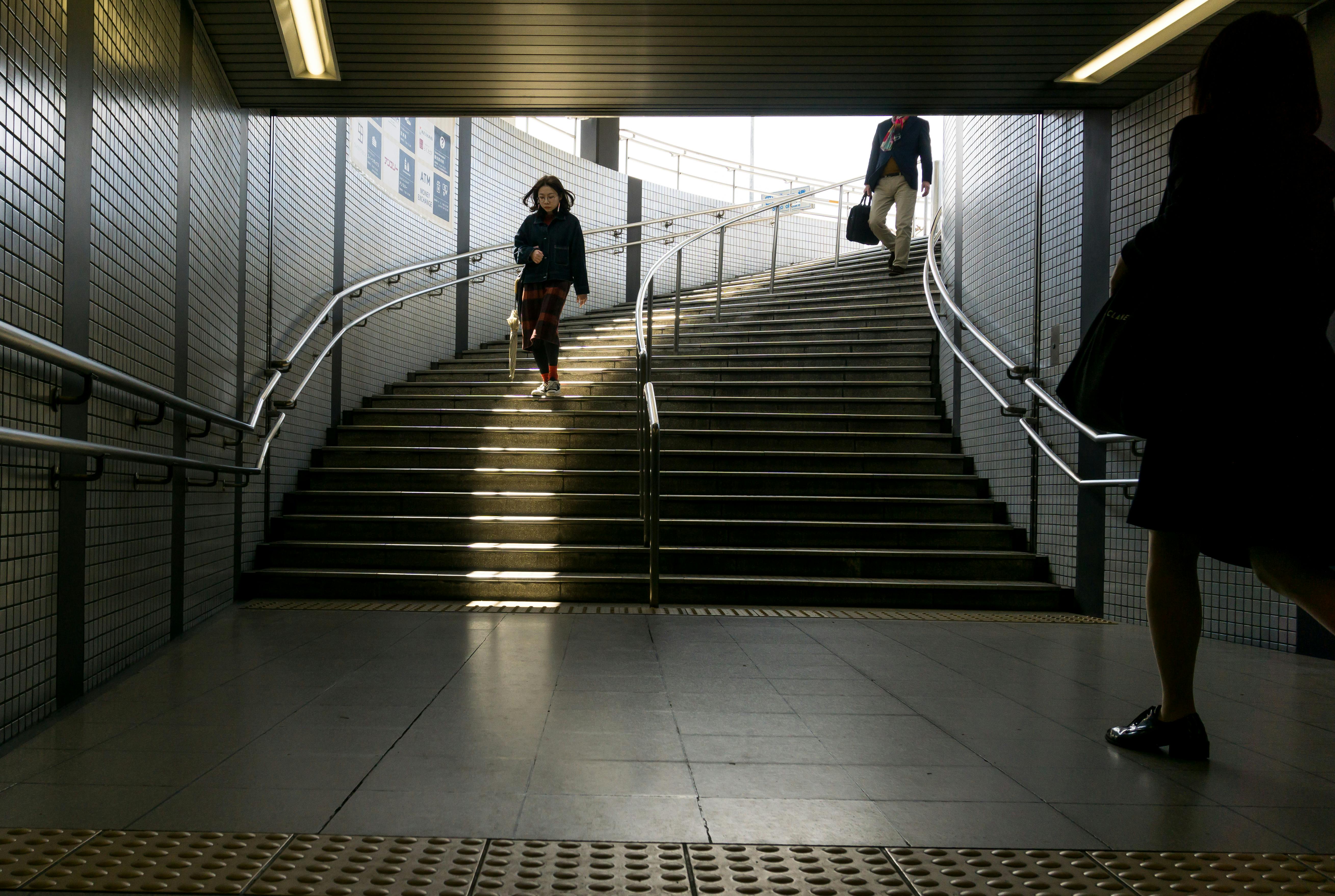 People Descending Underground Subway Stairs · Free Stock Photo