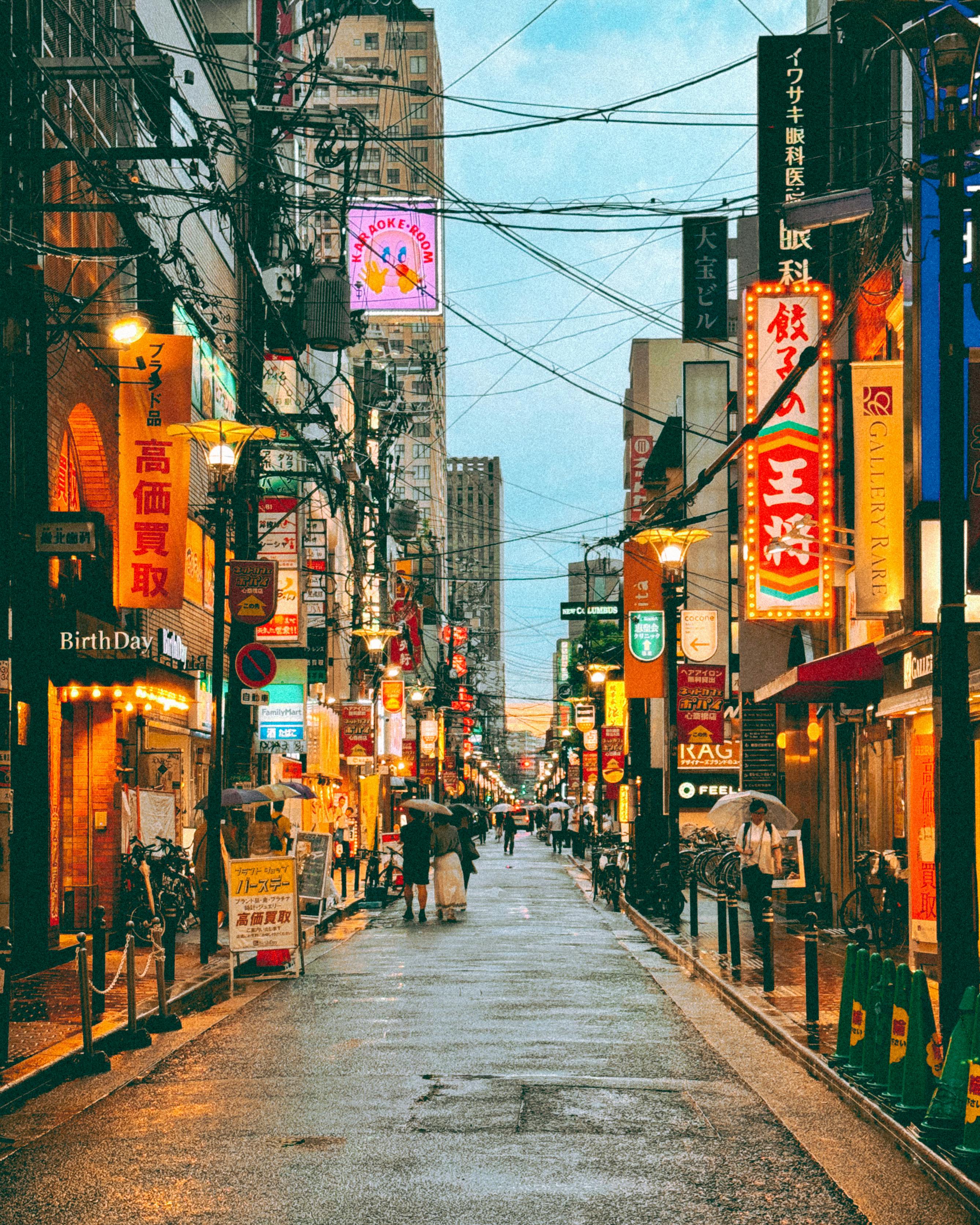 Bustling Street in Urban Japan at Dusk · Free Stock Photo