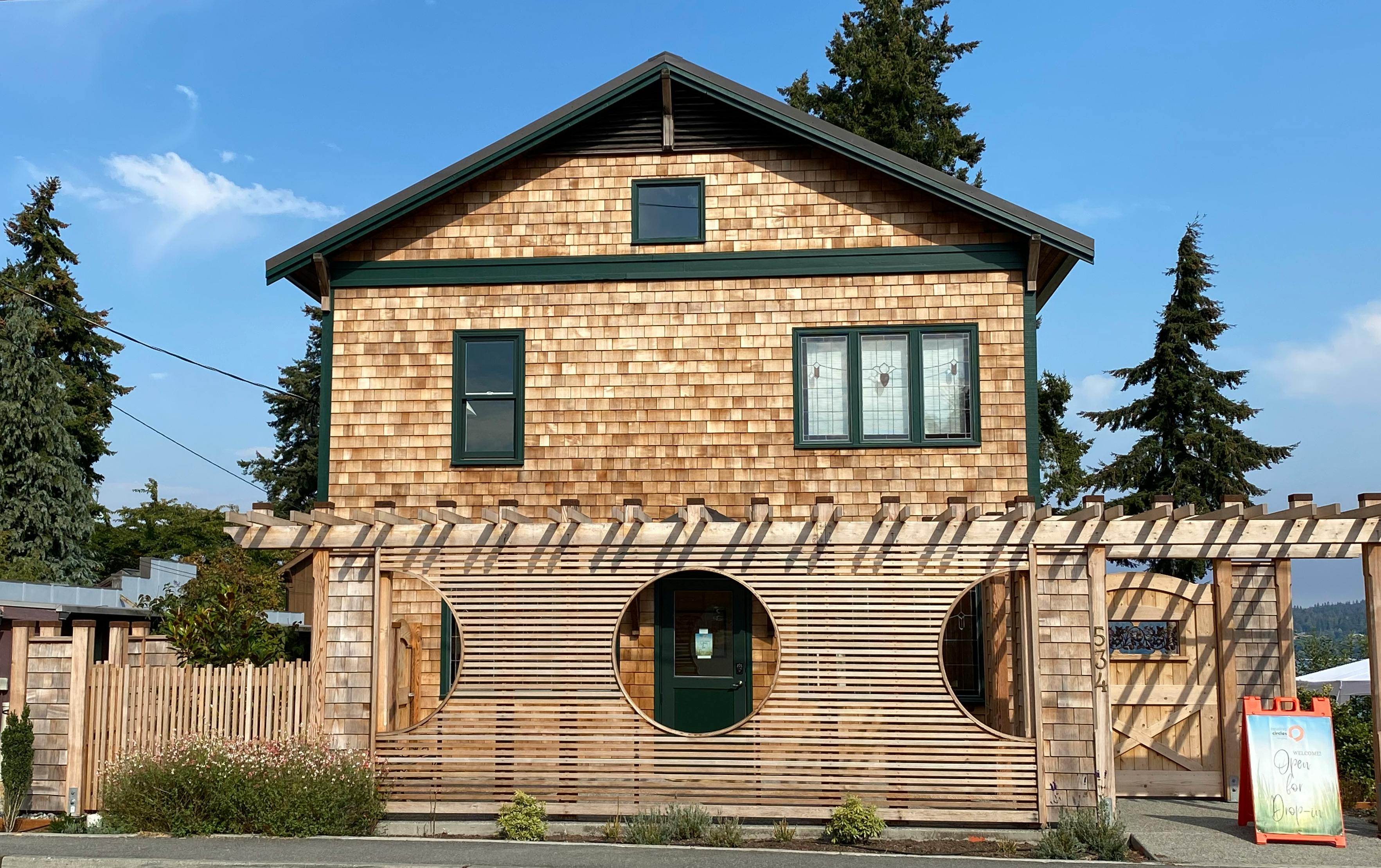 Rustic Wooden House with Unique Circular Decor · Free Stock Photo