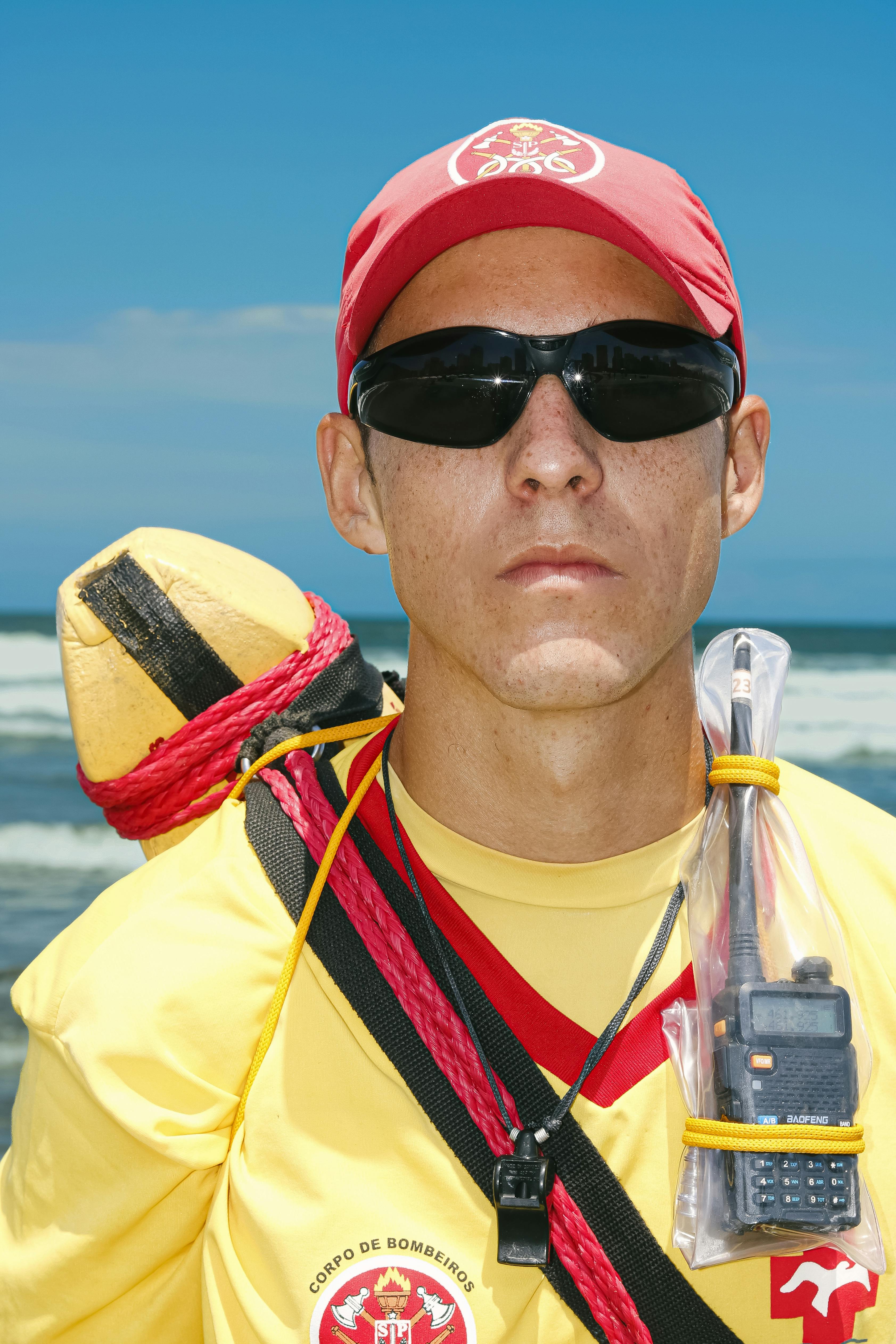 Professional Lifeguard with Rescue Equipment on Beach · Free Stock Photo