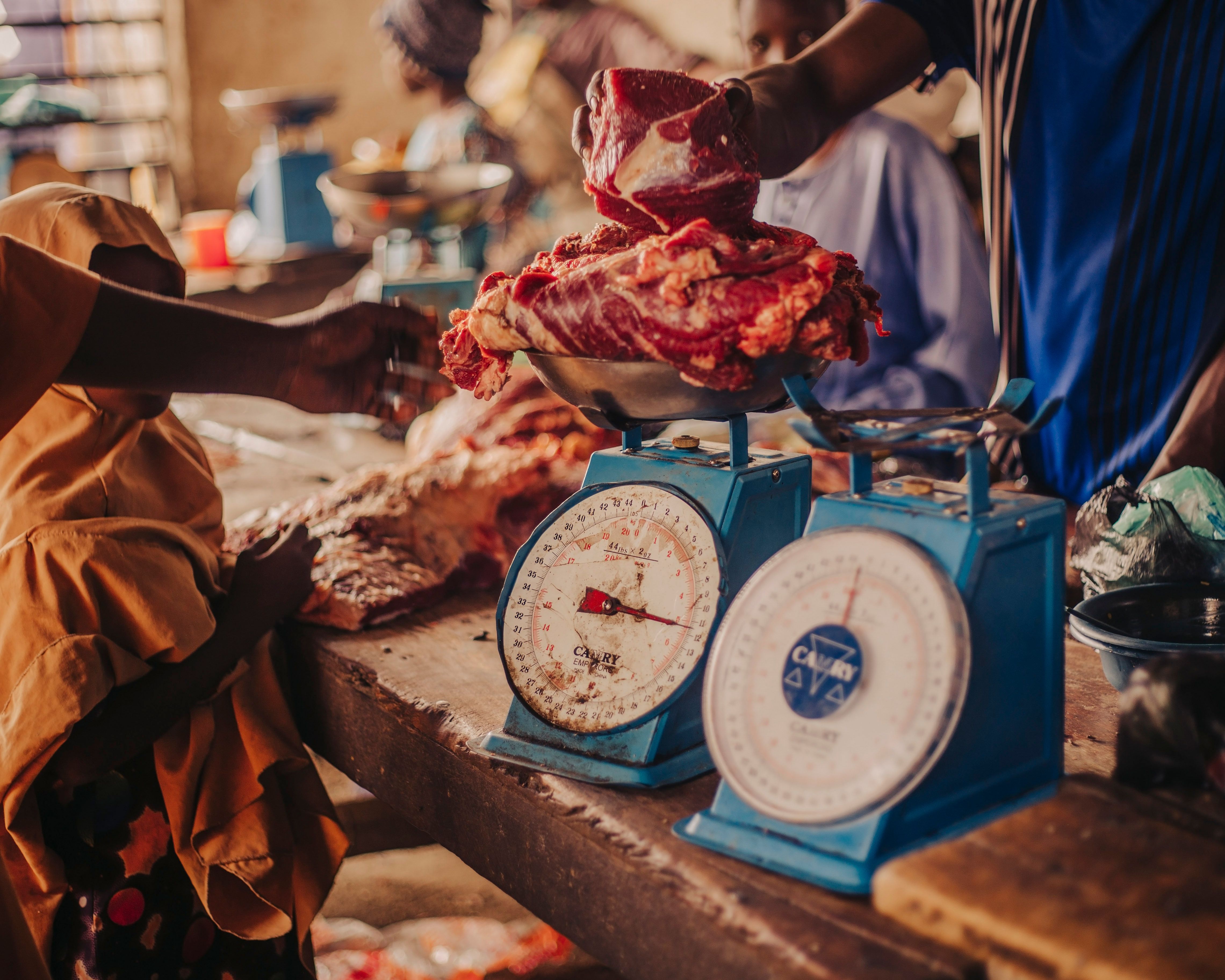 Local Market Scene with Meat Scales · Free Stock Photo