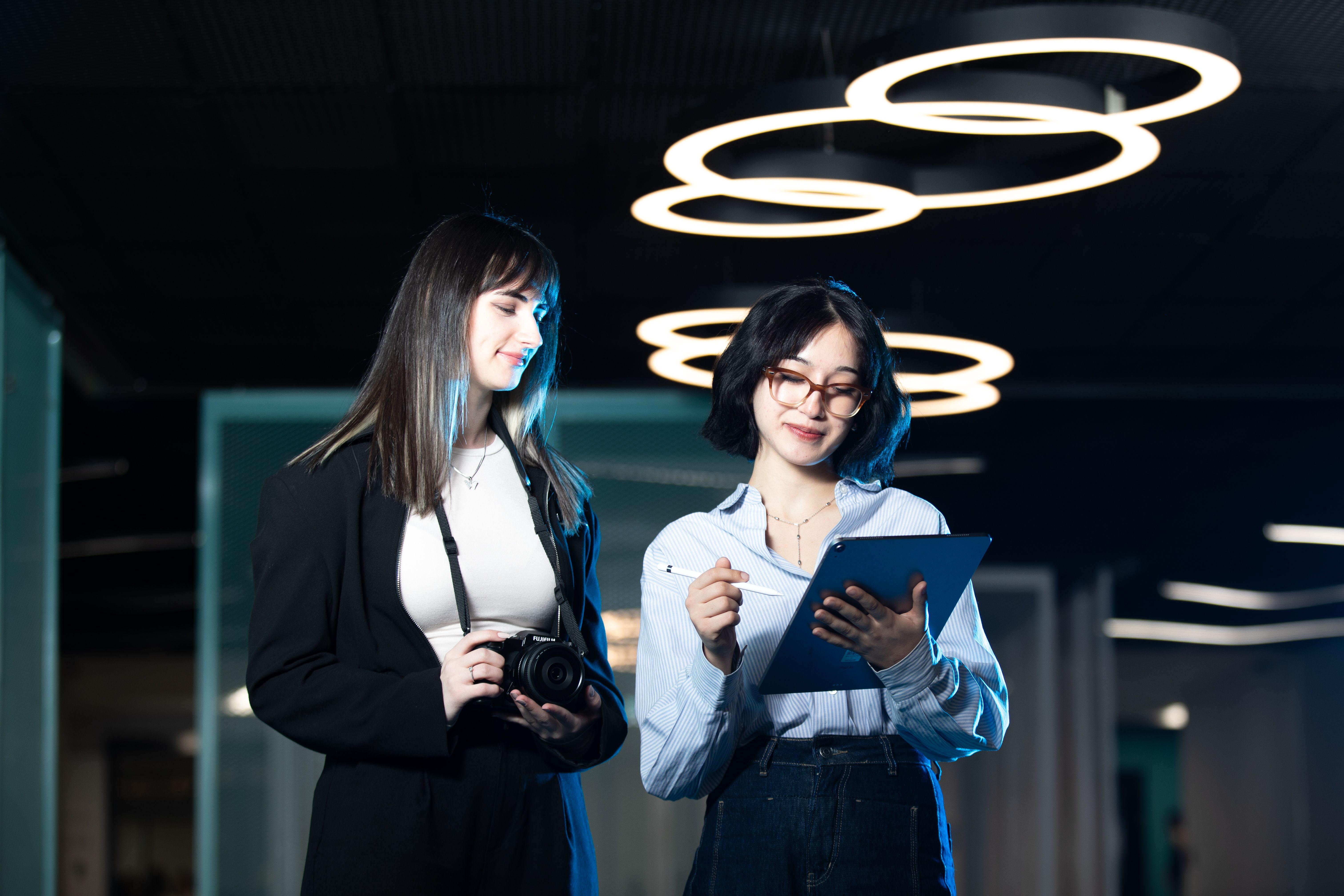Two Women Collaborating in Modern Office · Free Stock Photo