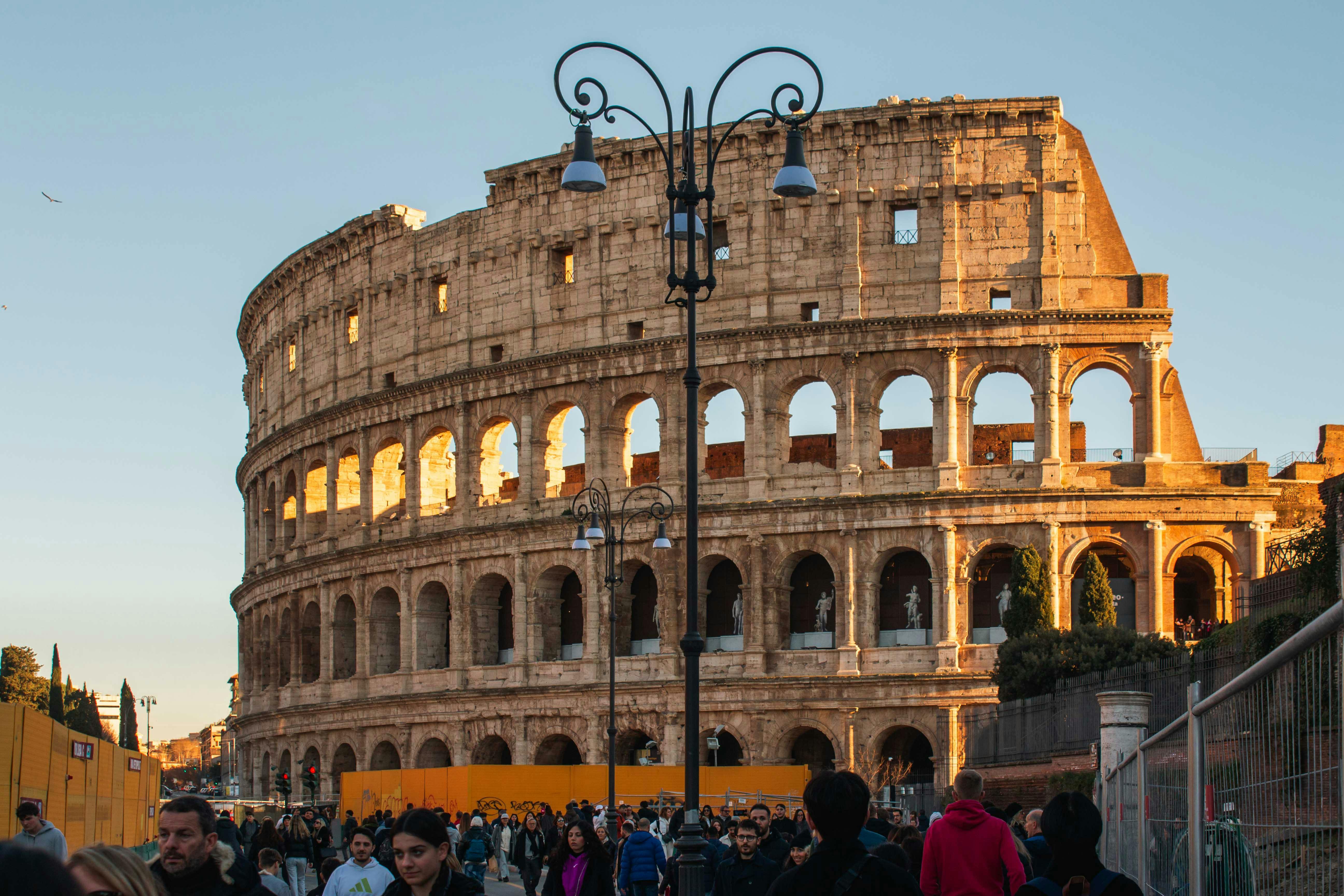 Crowded Street by Rome's Colosseum at Sunset · Free Stock Photo
