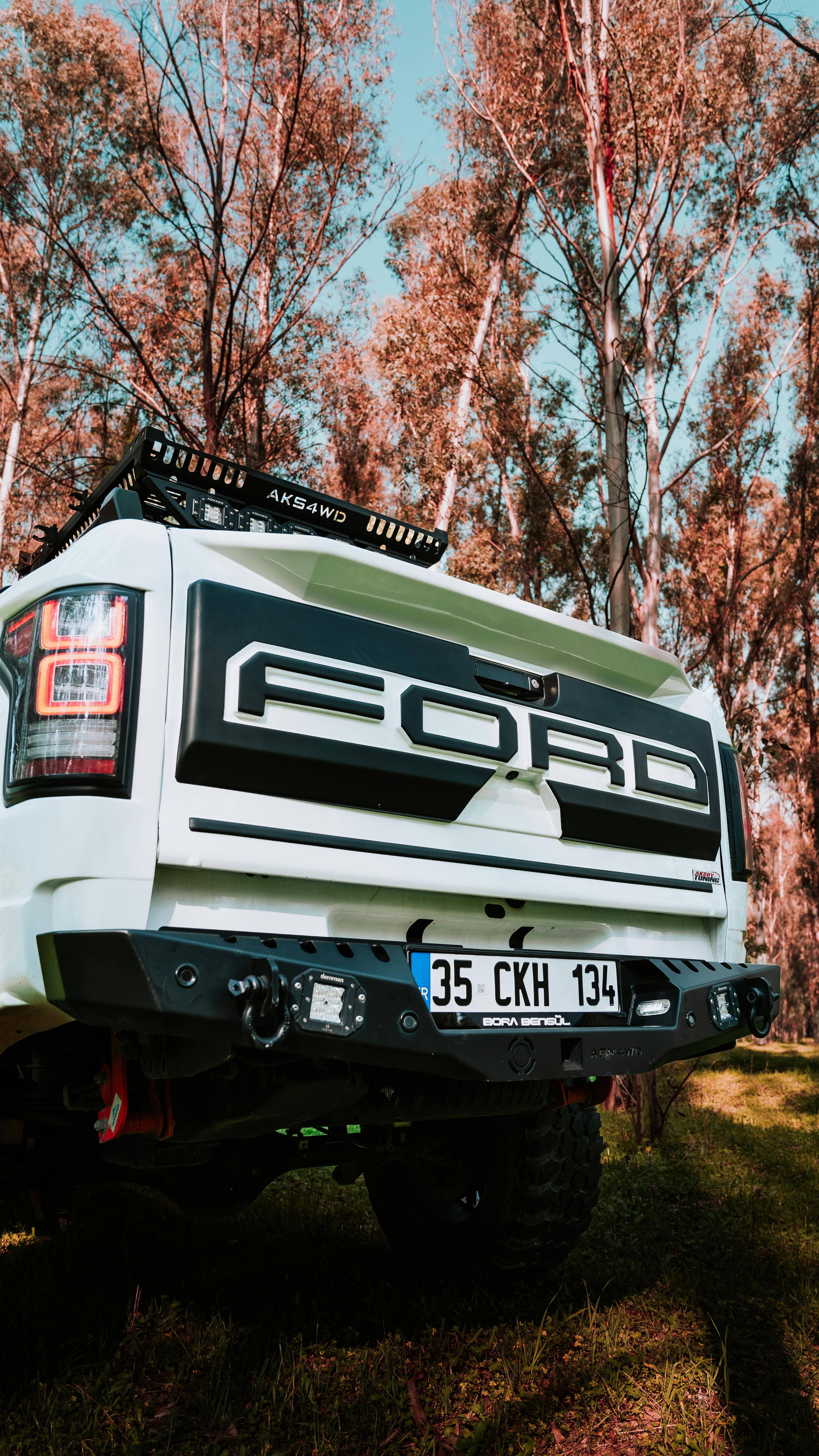 Off-road Ford Truck in Autumn Forest Setting · Free Stock Photo