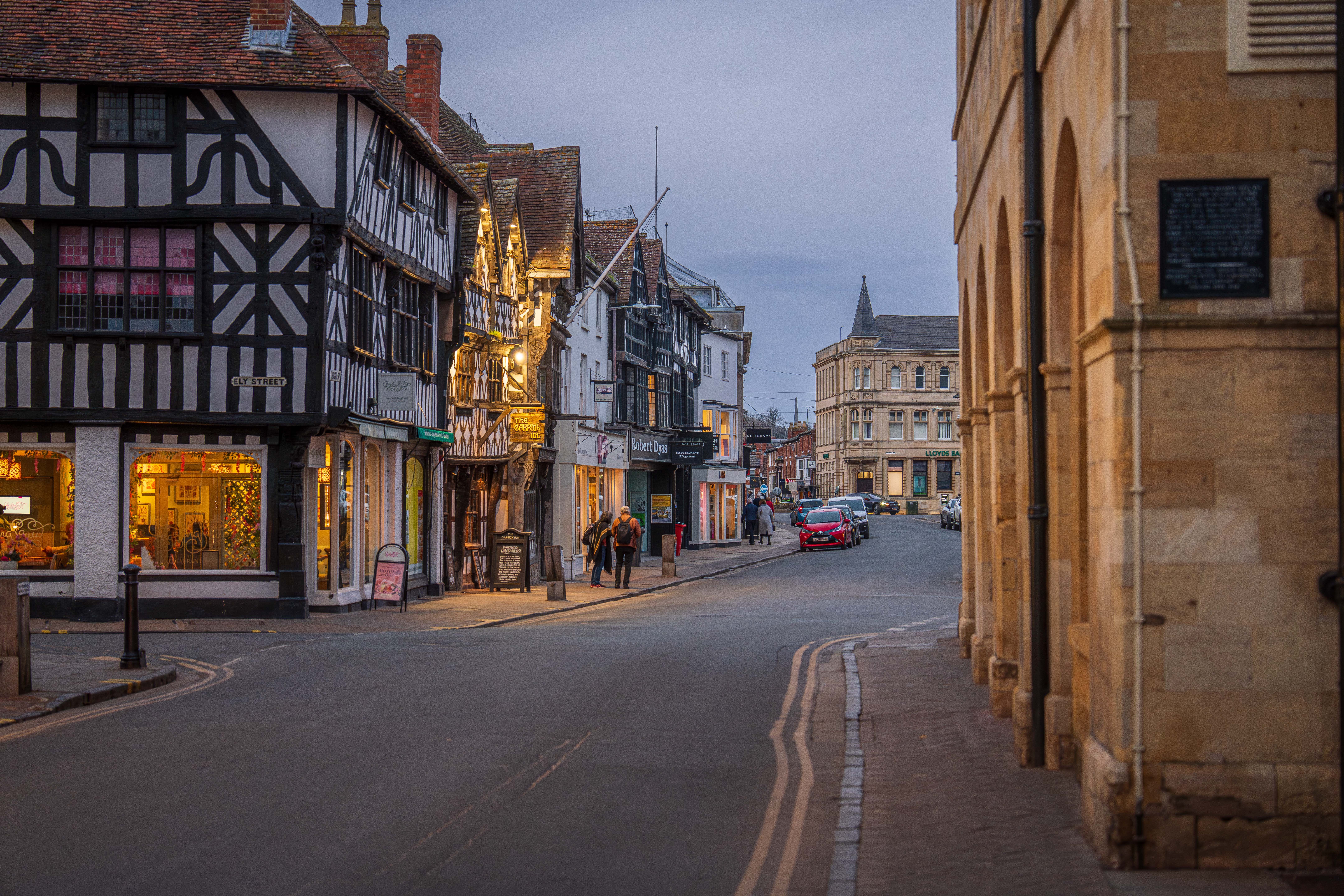 Charming Evening Street Scene in Historic Town · Free Stock Photo