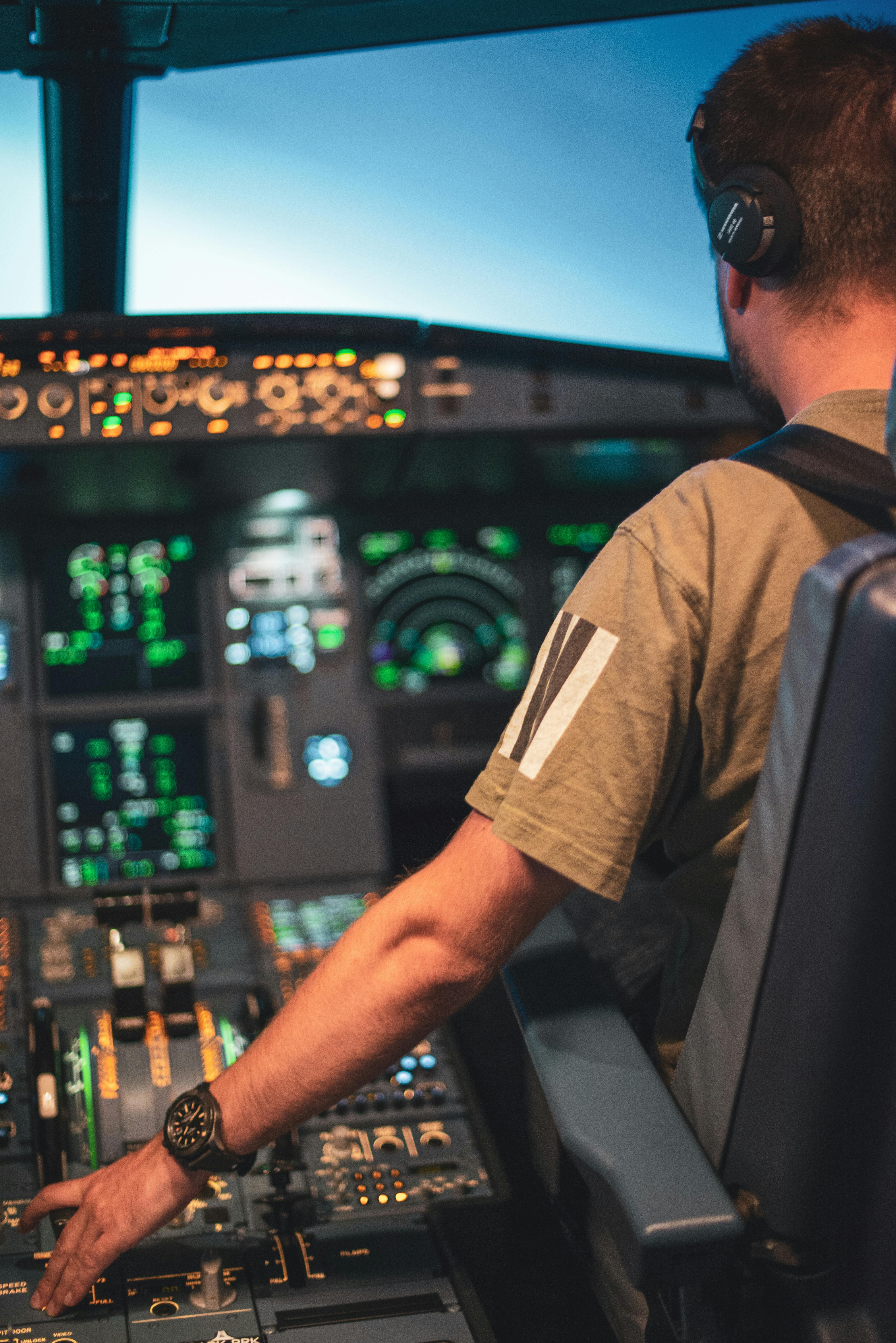 Pilot Operating Airbus Cockpit Simulation · Free Stock Photo