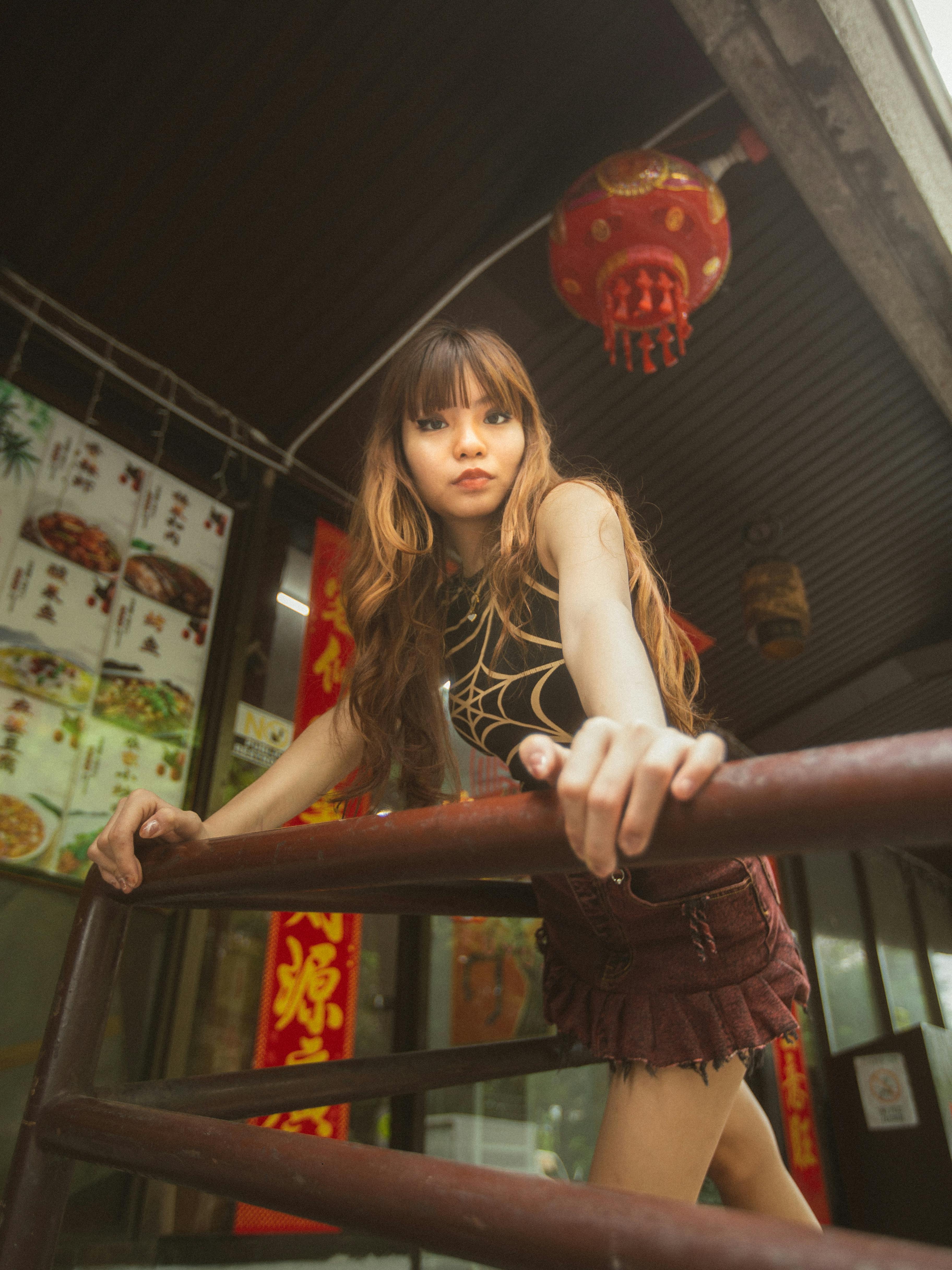 Artistic Portrait in Vibrant Chinatown Setting · Free Stock Photo