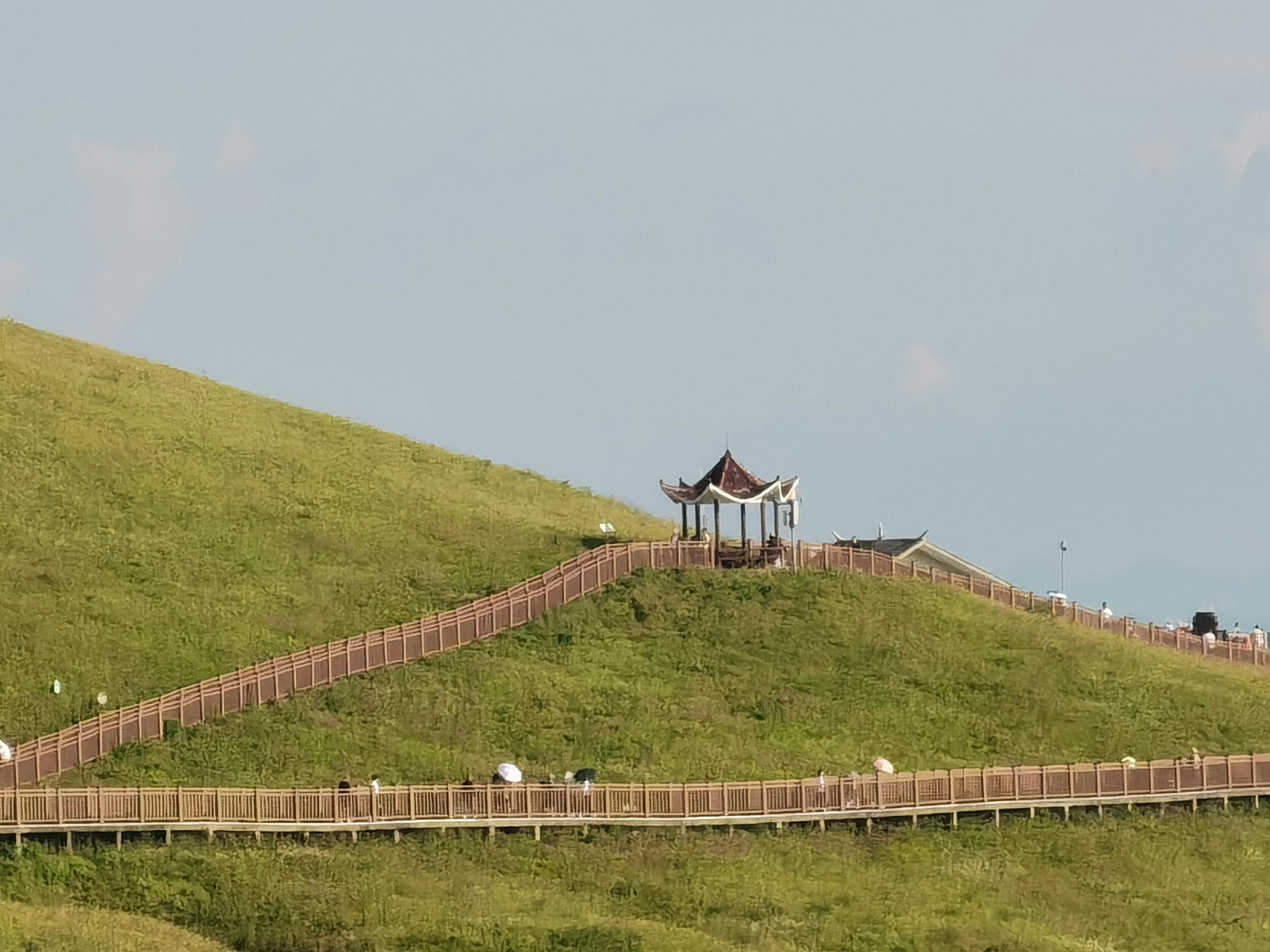 Serene Hilltop Pavilion with Wooden Pathway · Free Stock Photo