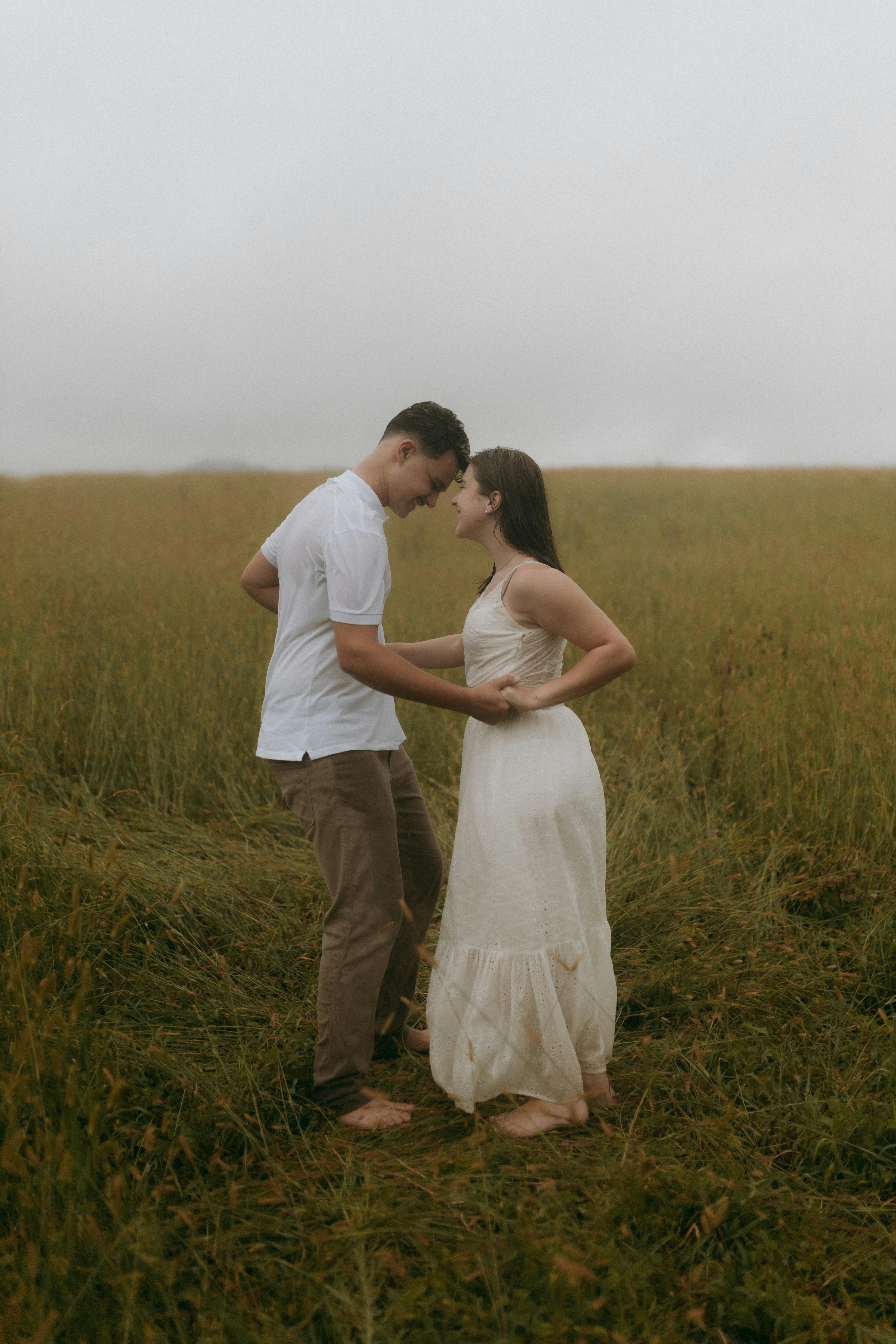 Romantic Couple Dancing in a Field · Free Stock Photo