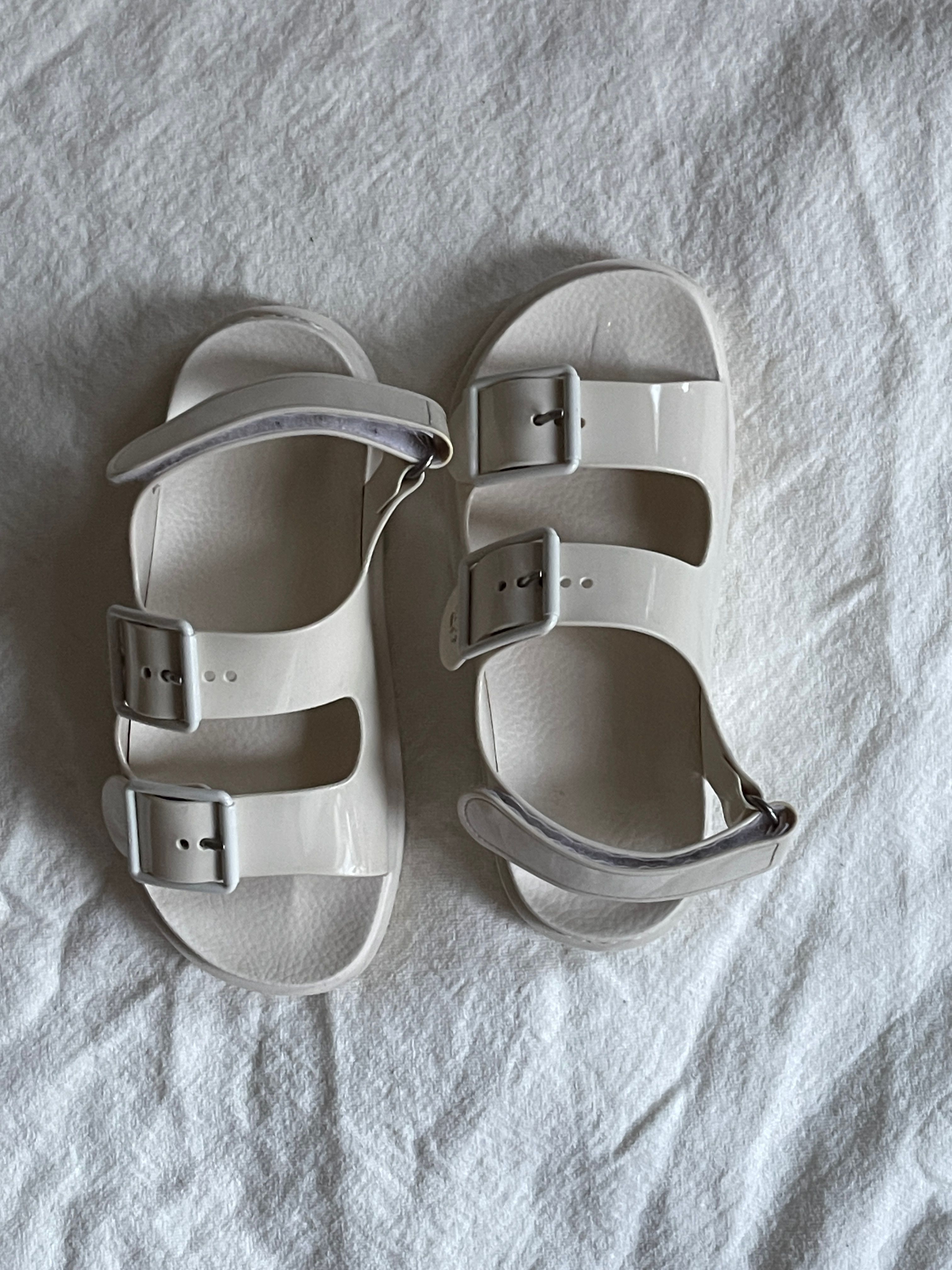 White Sandals on Textured Fabric Background · Free Stock Photo