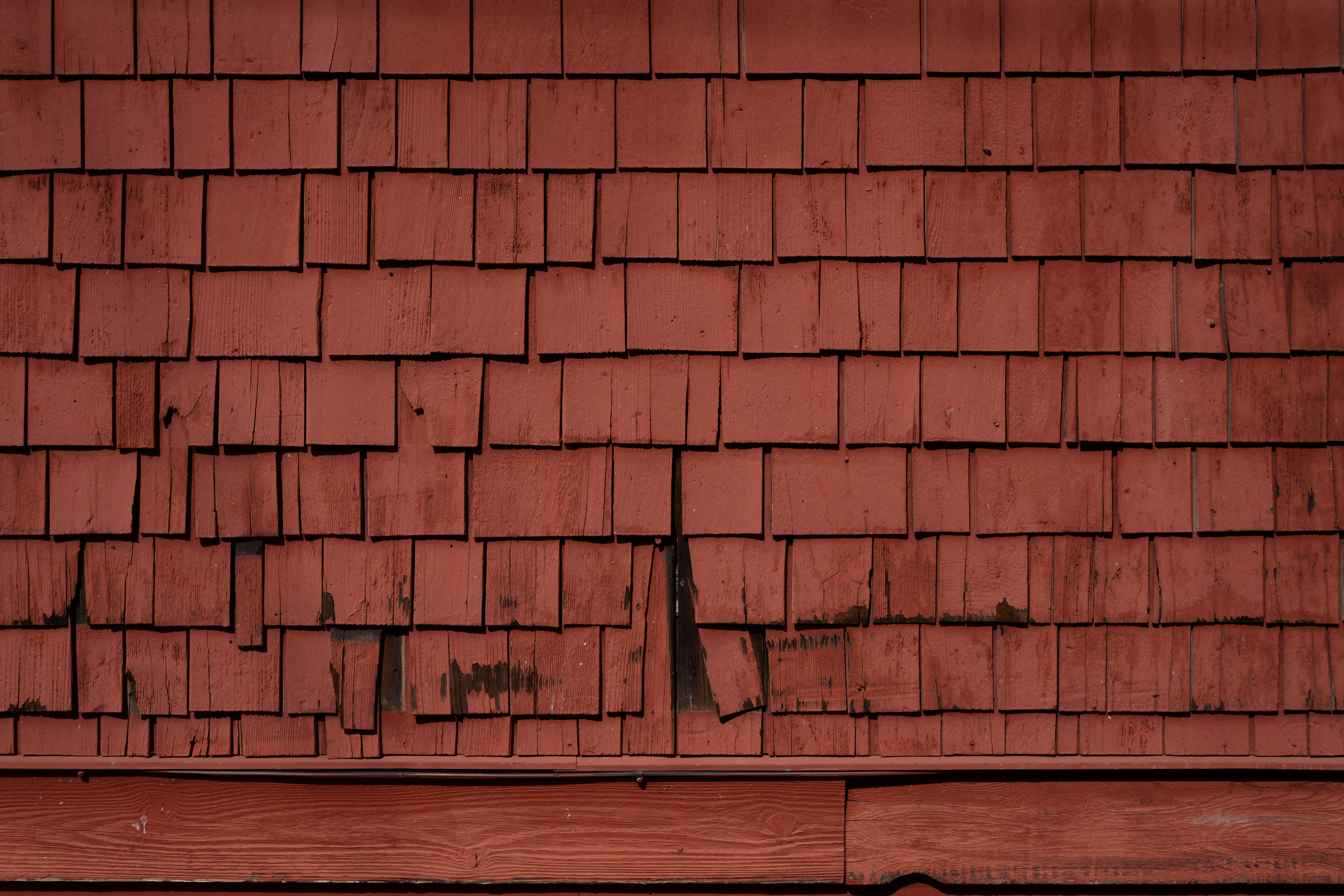 Weathered Red Wooden Shingles on Building Exterior · Free Stock Photo