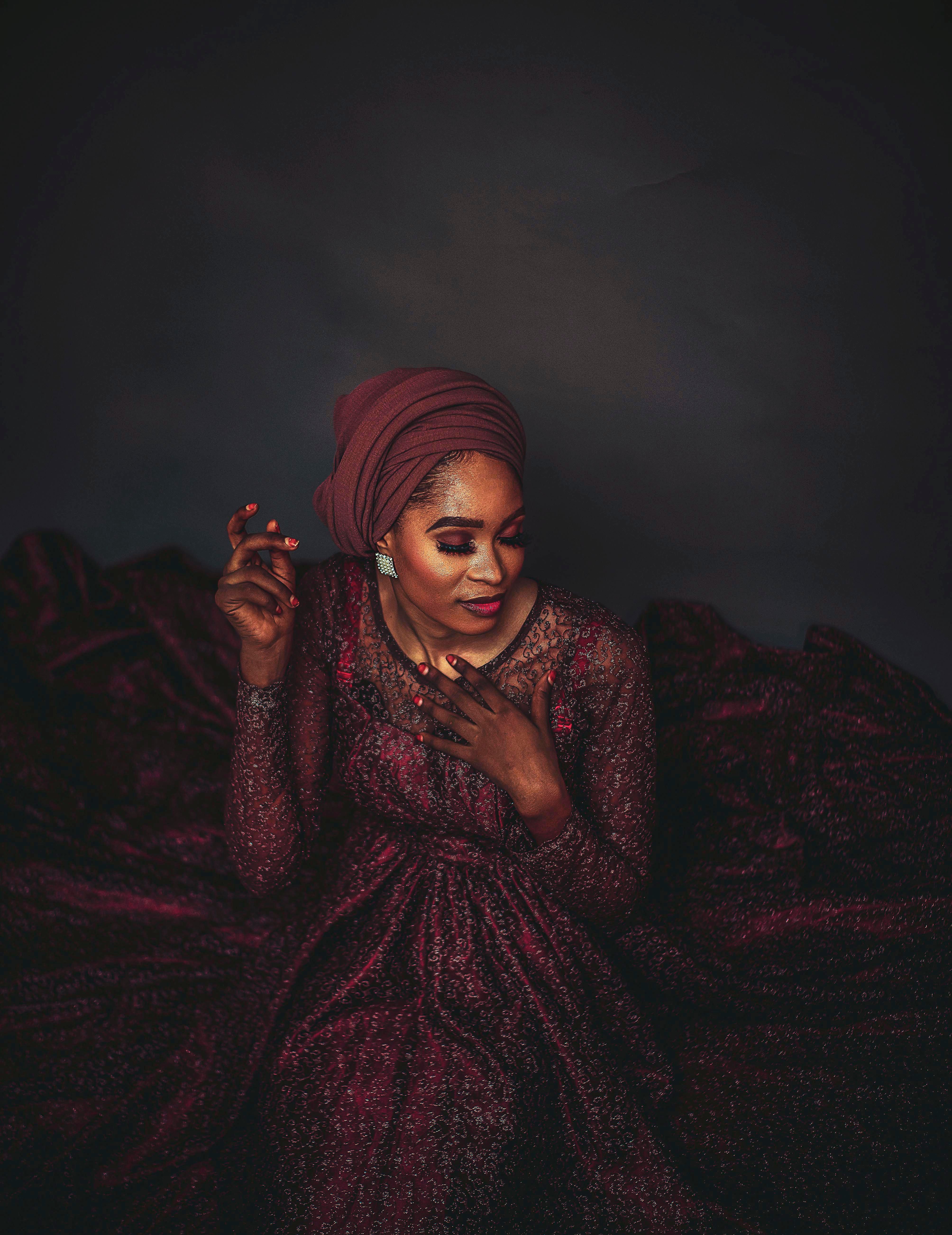 Elegant Portrait of a Woman in Gleaming Attire · Free Stock Photo