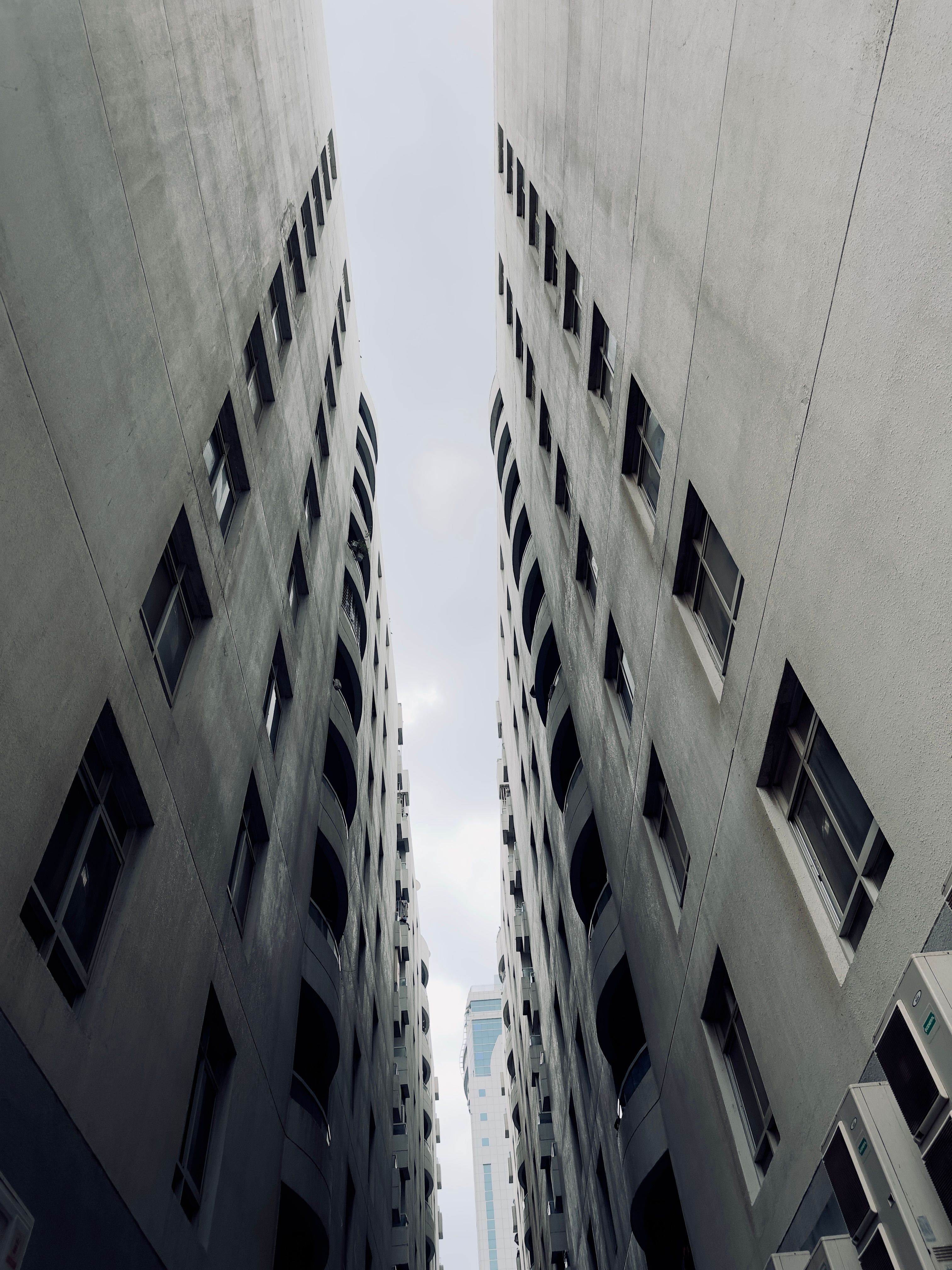 Sky Peeking Through Opening Between Buildings · Free Stock Photo