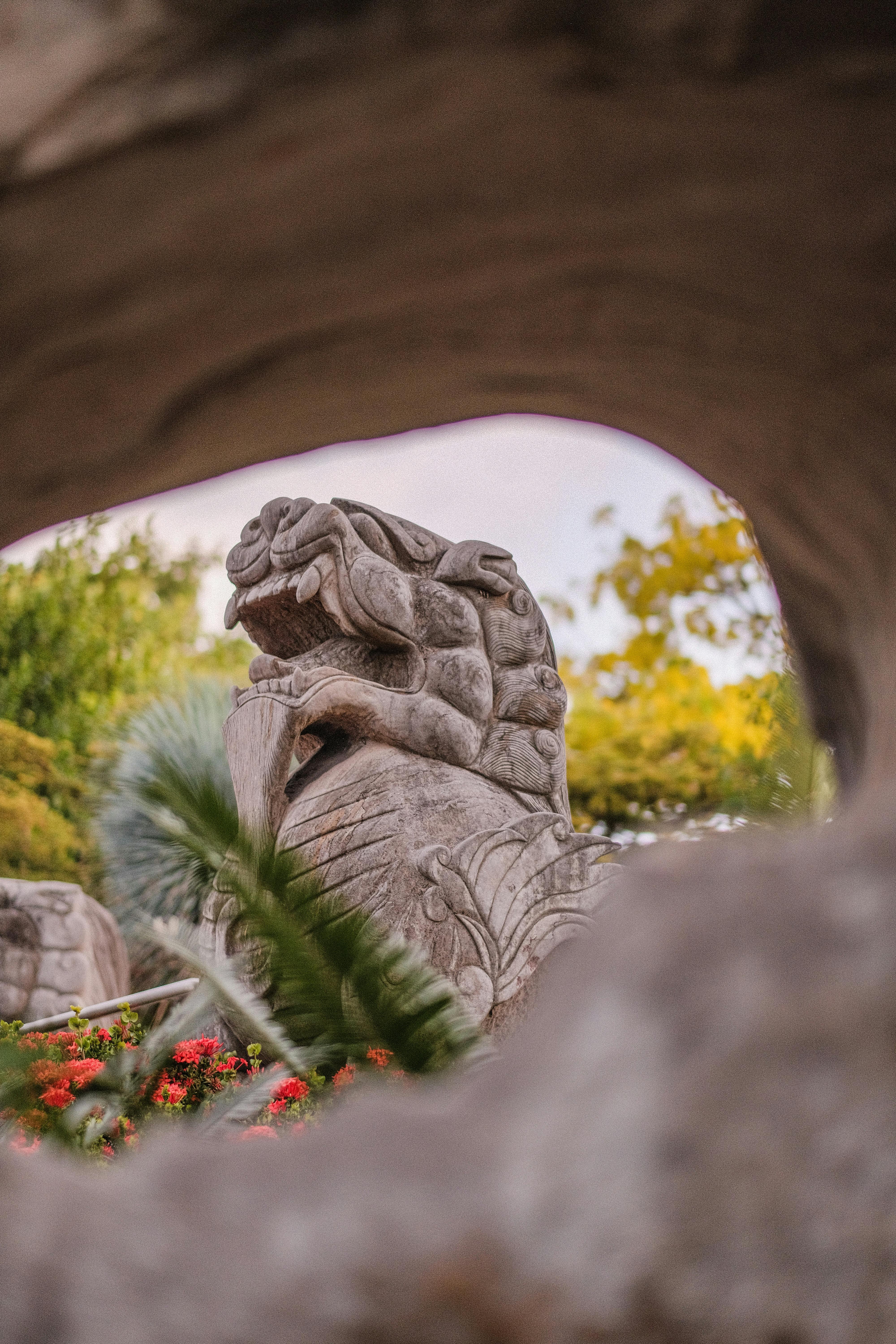 Serene Stone Dragon Statue in Garden Frame · Free Stock Photo