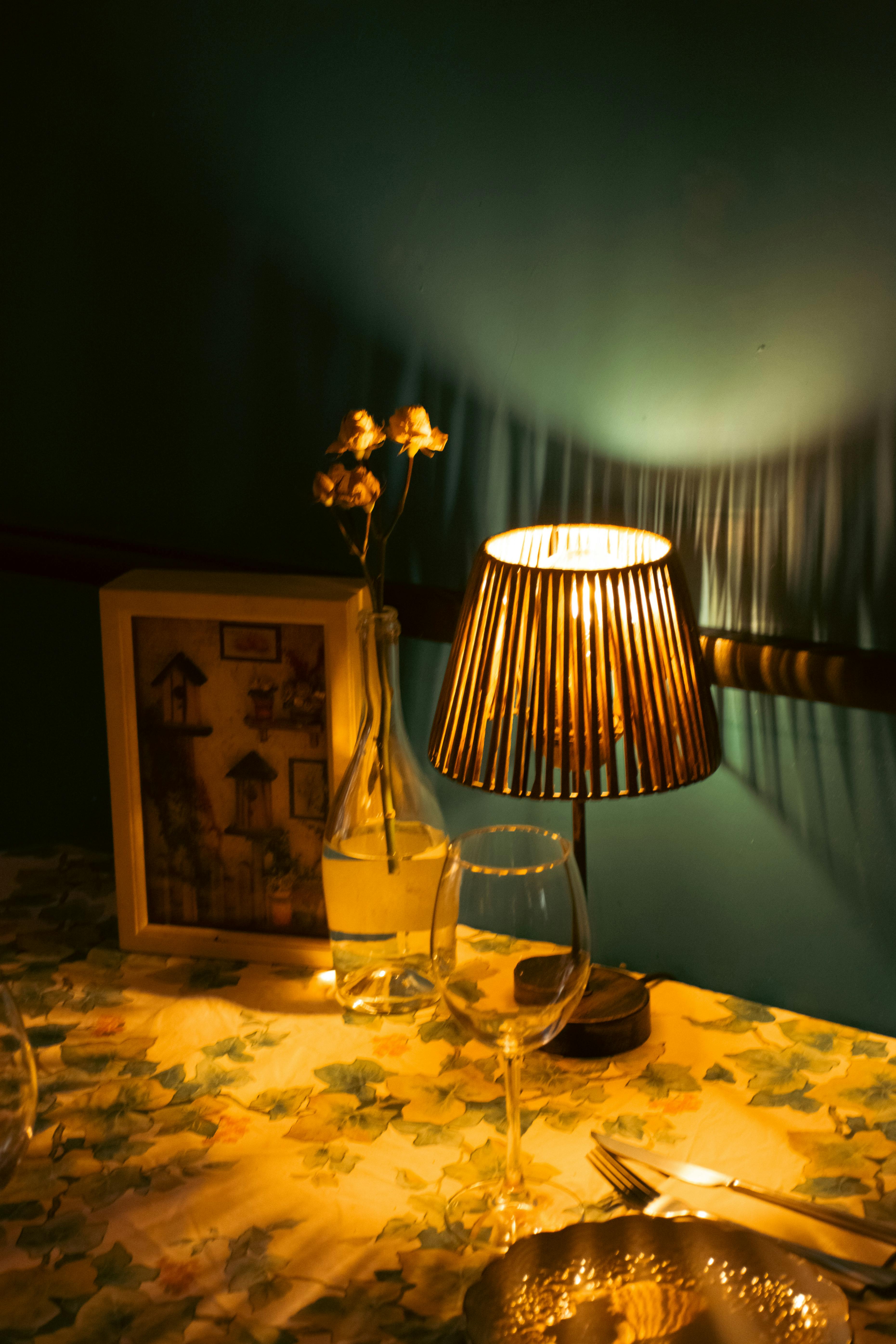 Cozy Table Setting with Warm Lamp Light · Free Stock Photo