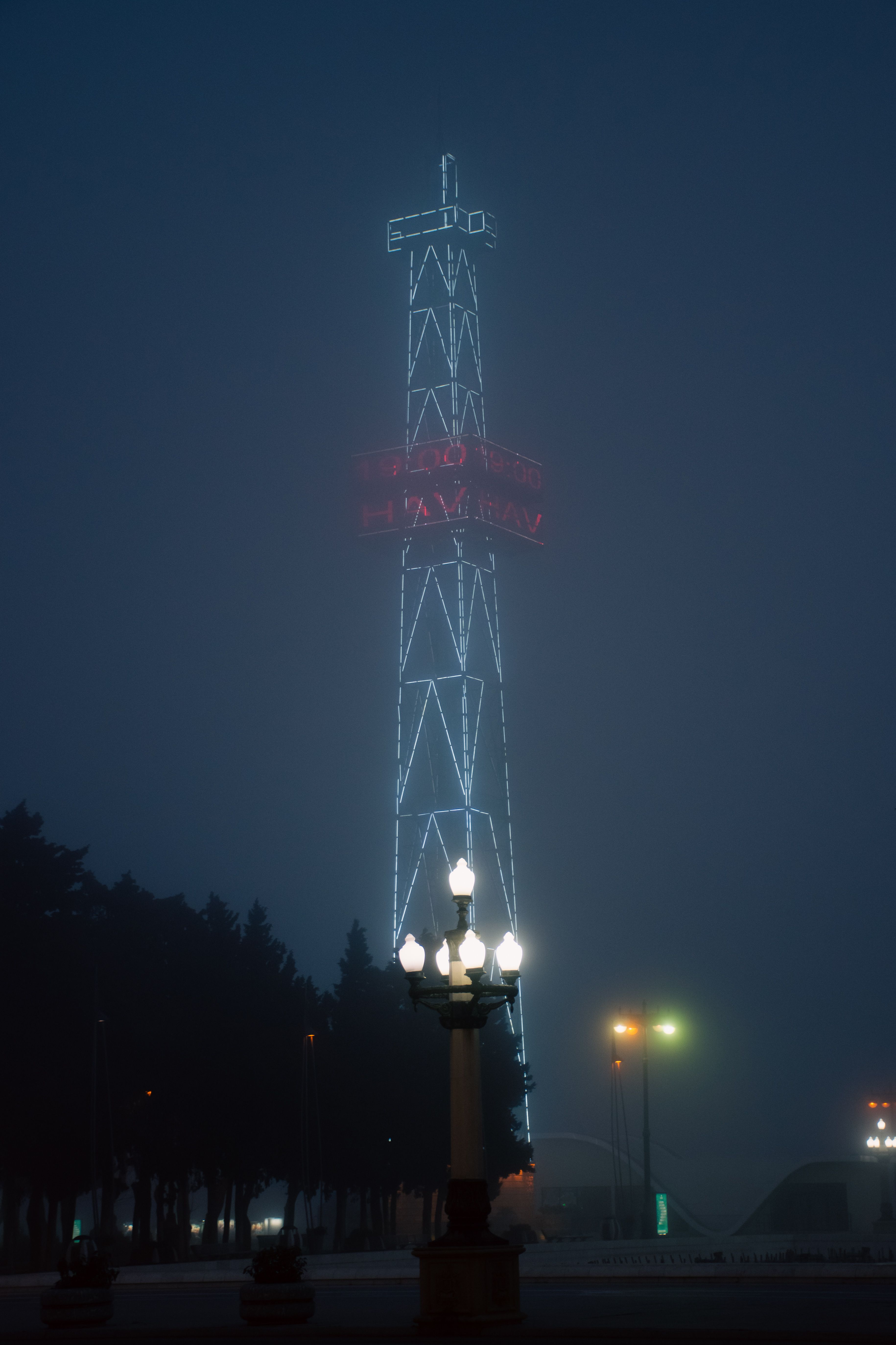 Foggy Night Radio Tower in Urban Setting · Free Stock Photo