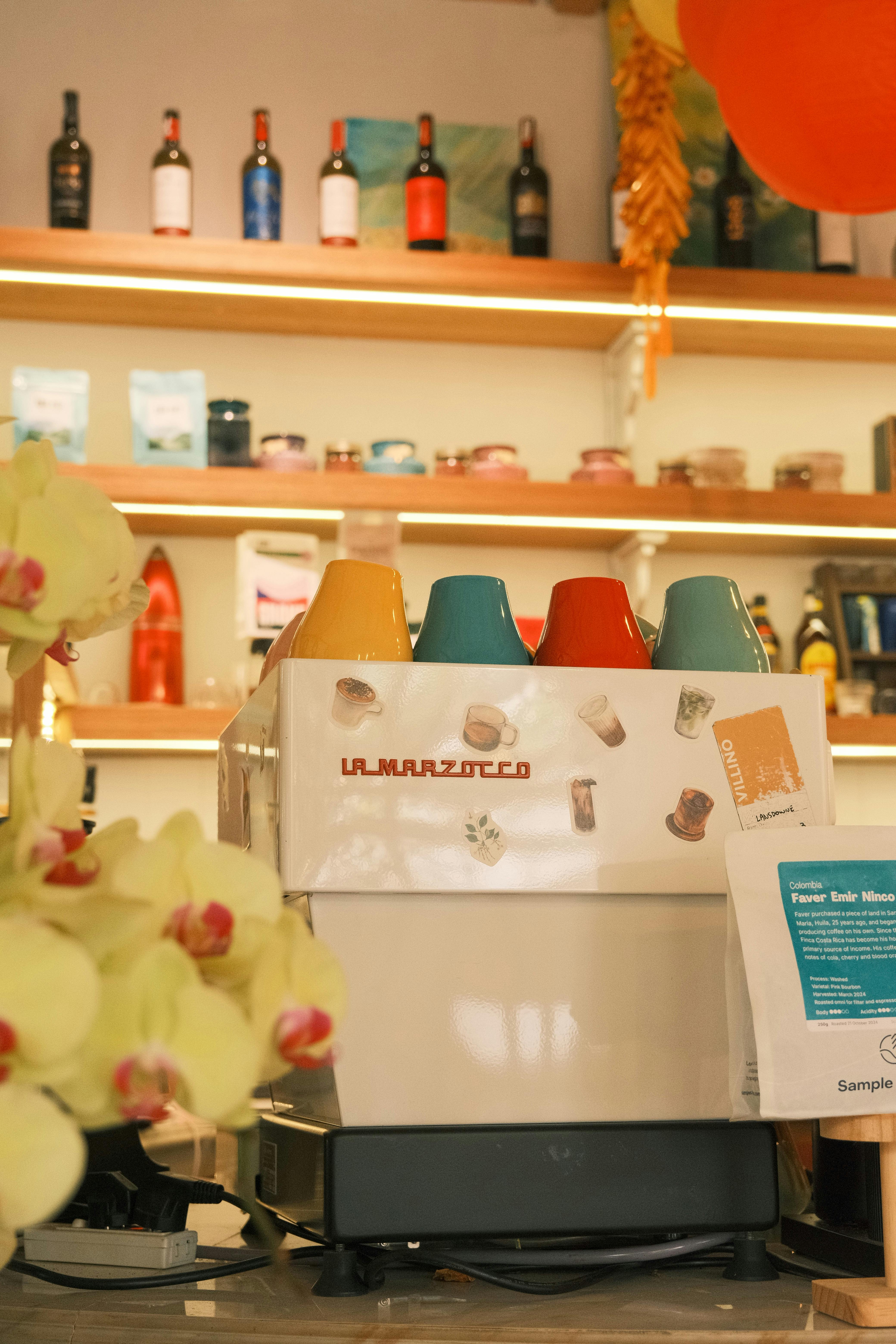 Colorful Coffee Shop Interior with Espresso Machine · Free Stock Photo