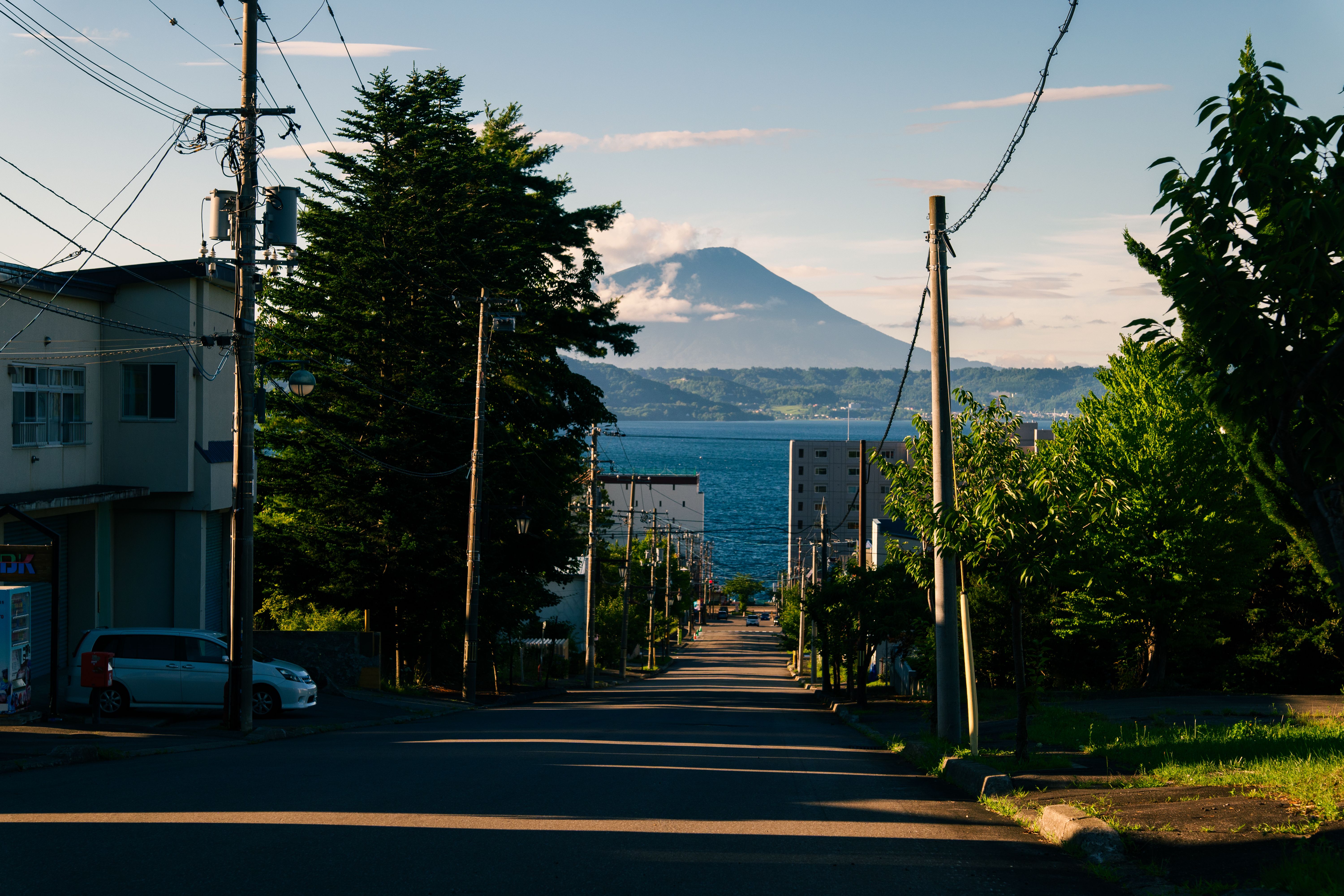 Scenic Street View with Distant Mountain · Free Stock Photo