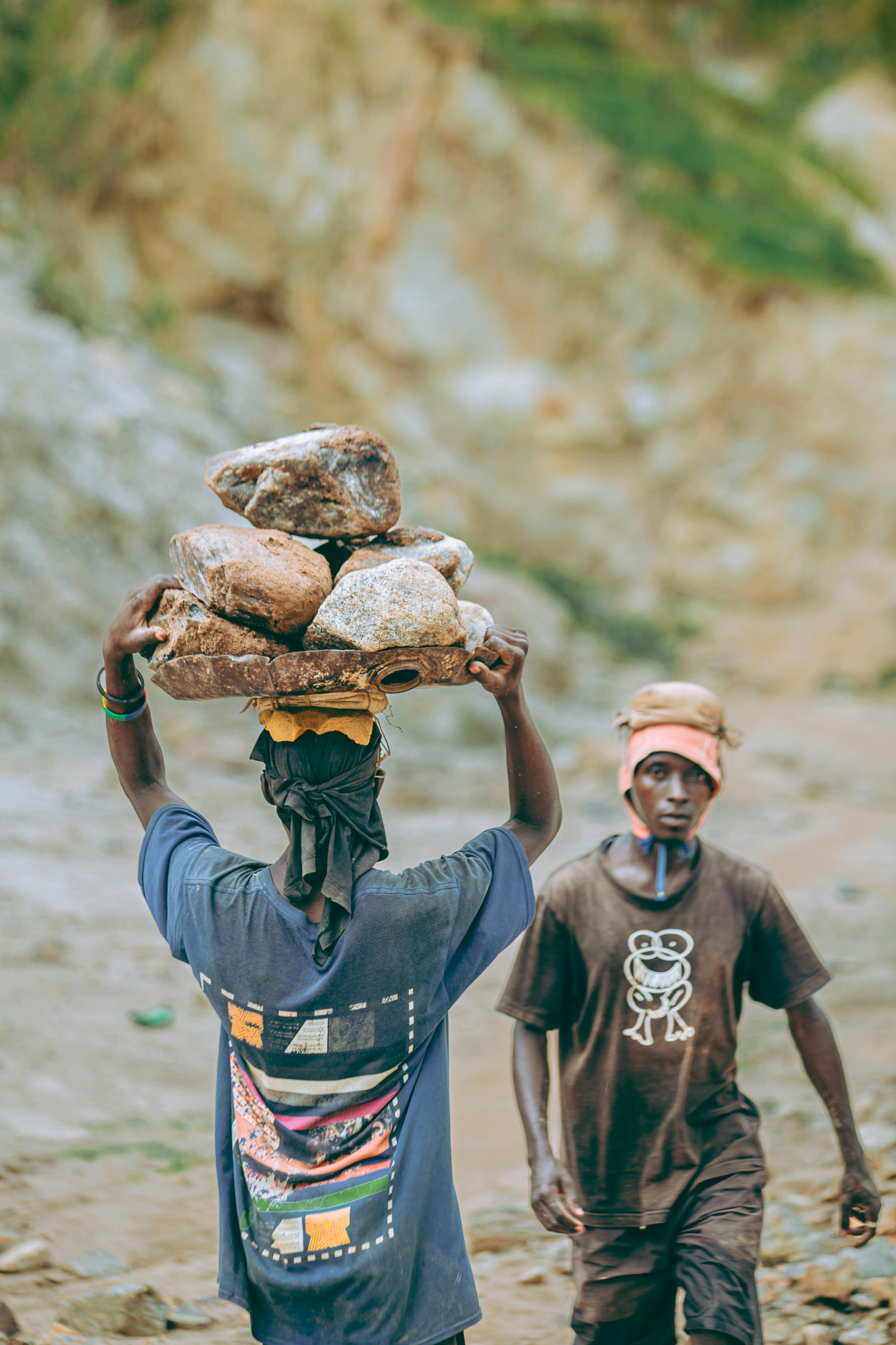 Manual Laborers Carrying Stones in Quarry · Free Stock Photo