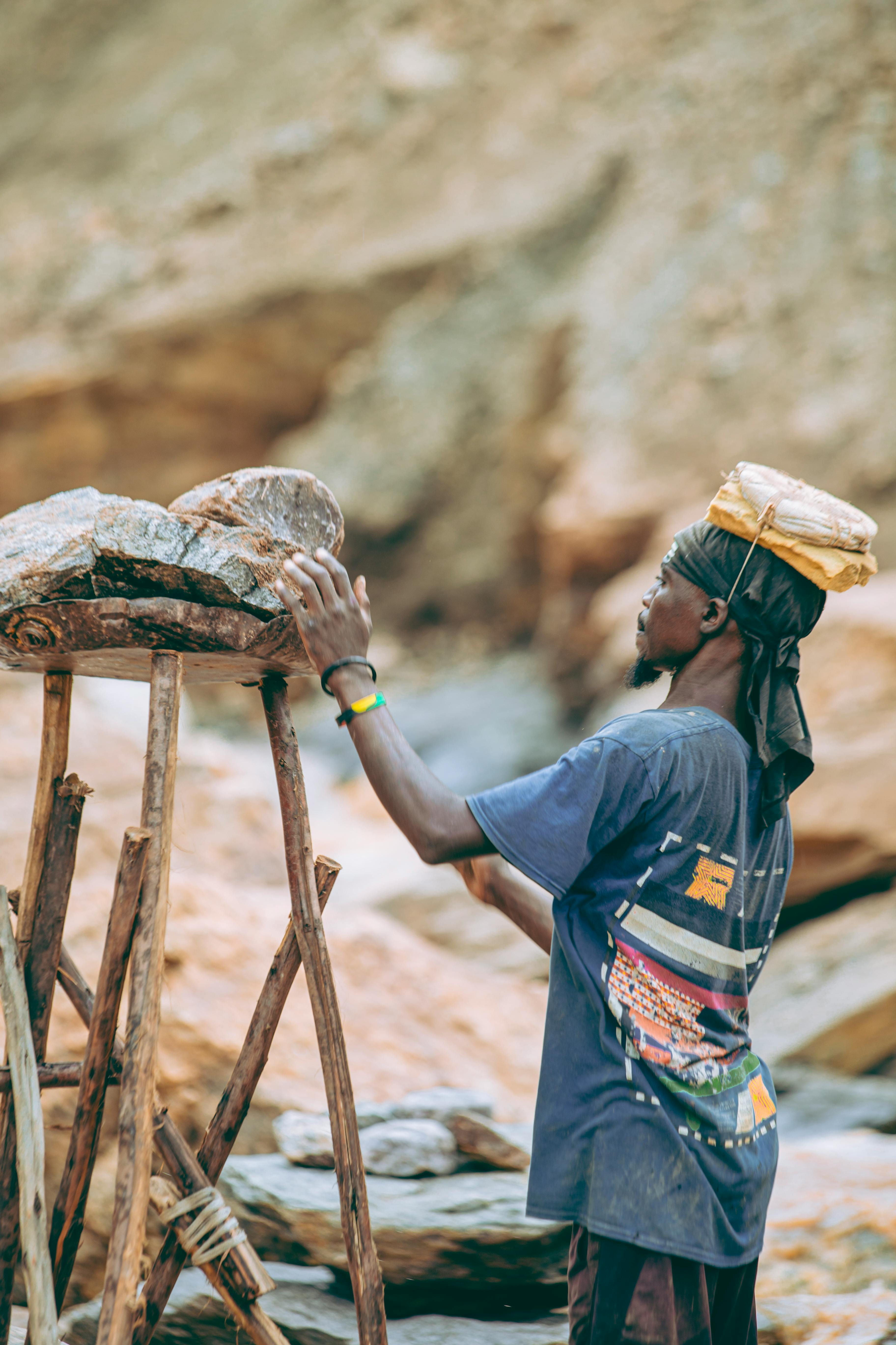 Miner working with rocks in a quarry · Free Stock Photo