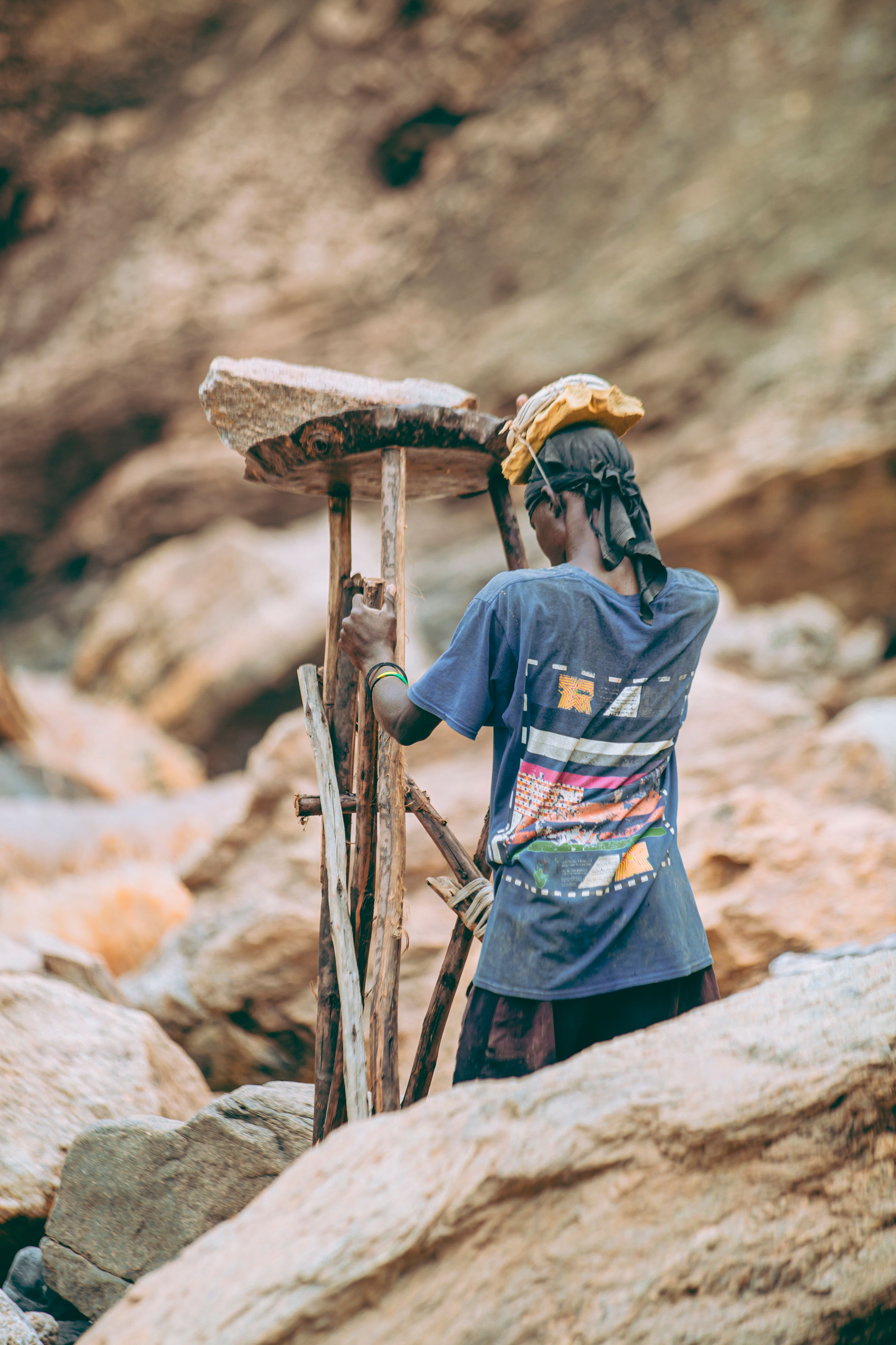 Person Working in Rocky Outdoor Setting · Free Stock Photo