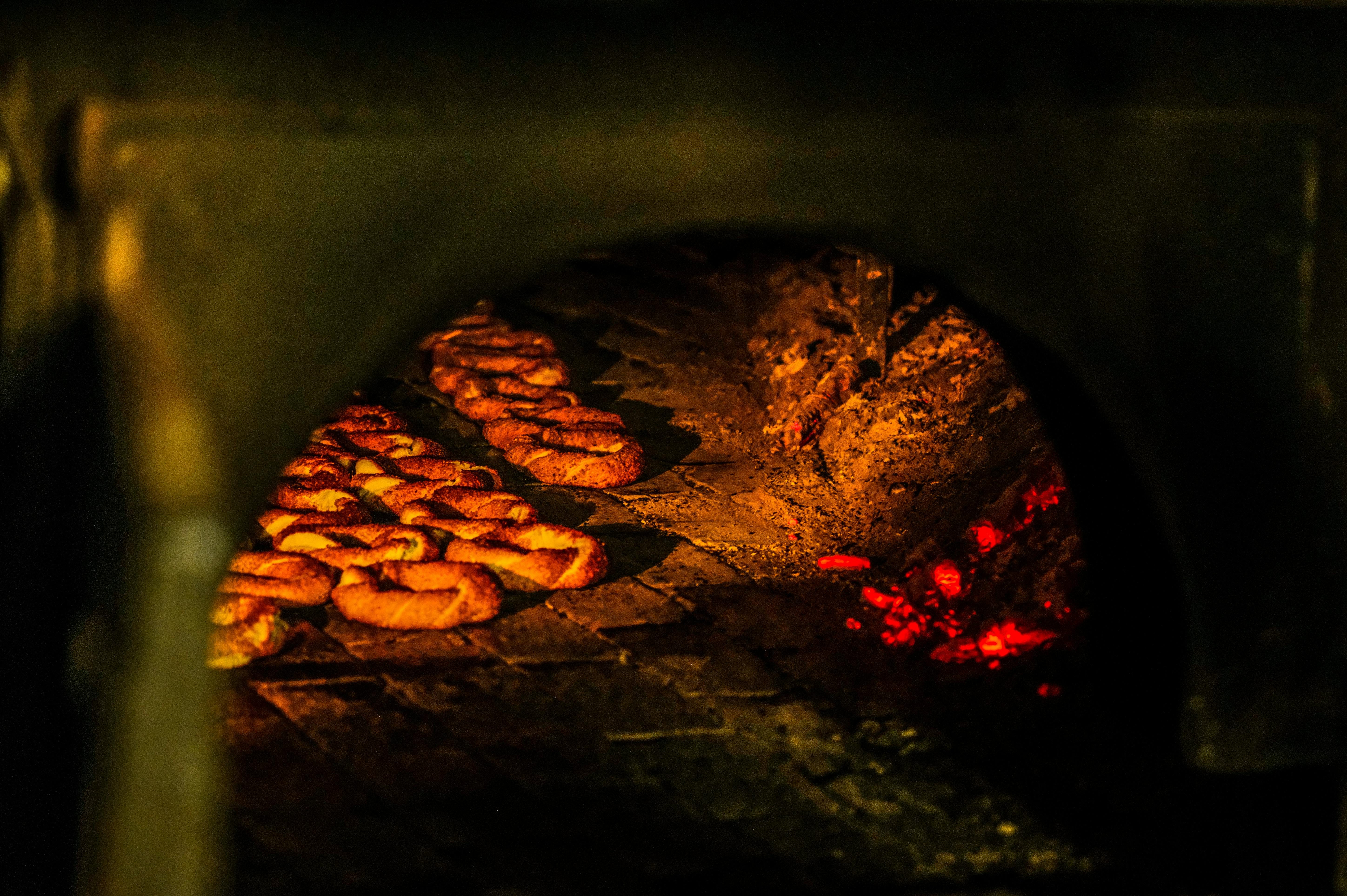 Traditional Bread Baking in Wood-Fired Oven · Free Stock Photo
