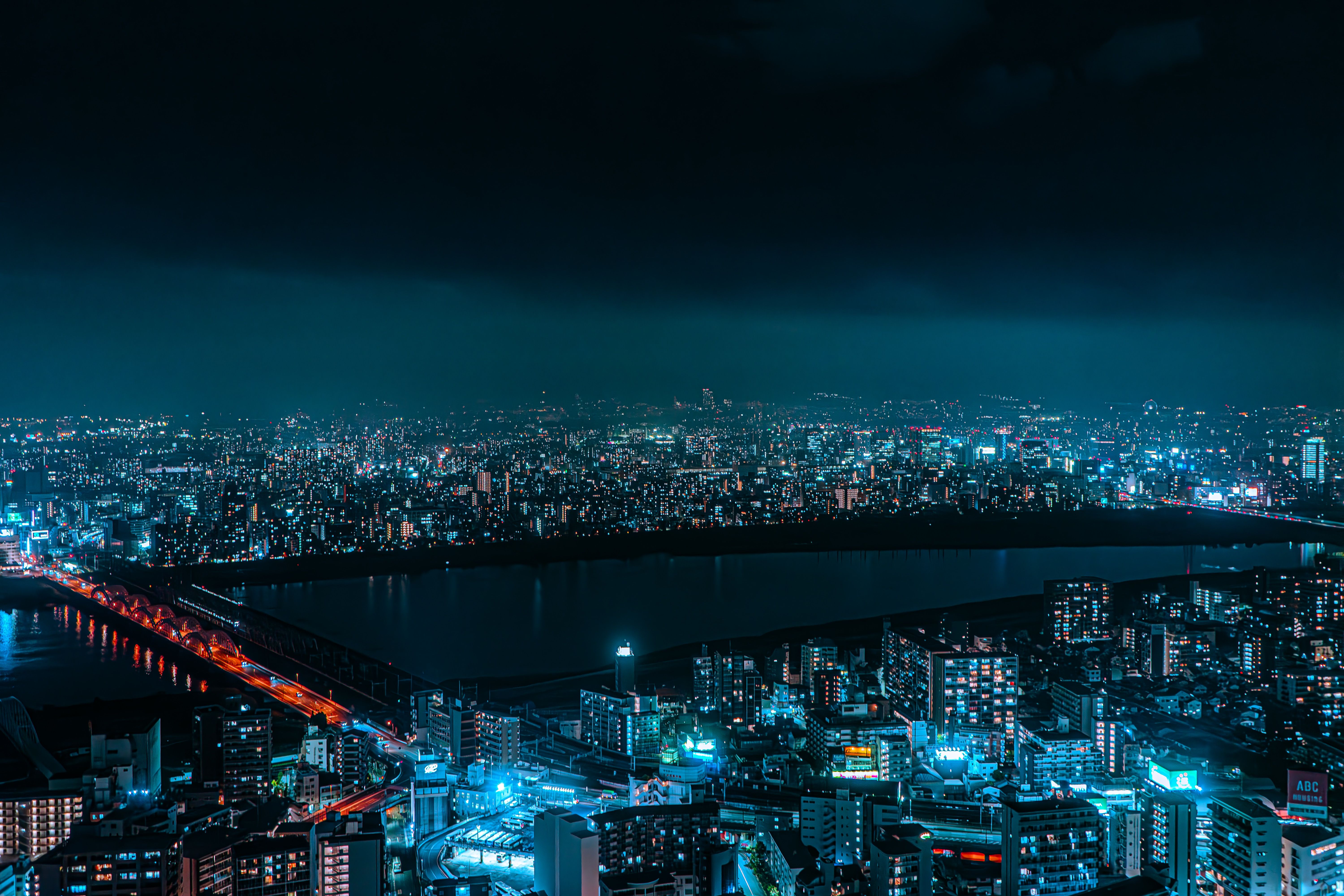 Stunning Night View of Urban Cityscape with River · Free Stock Photo