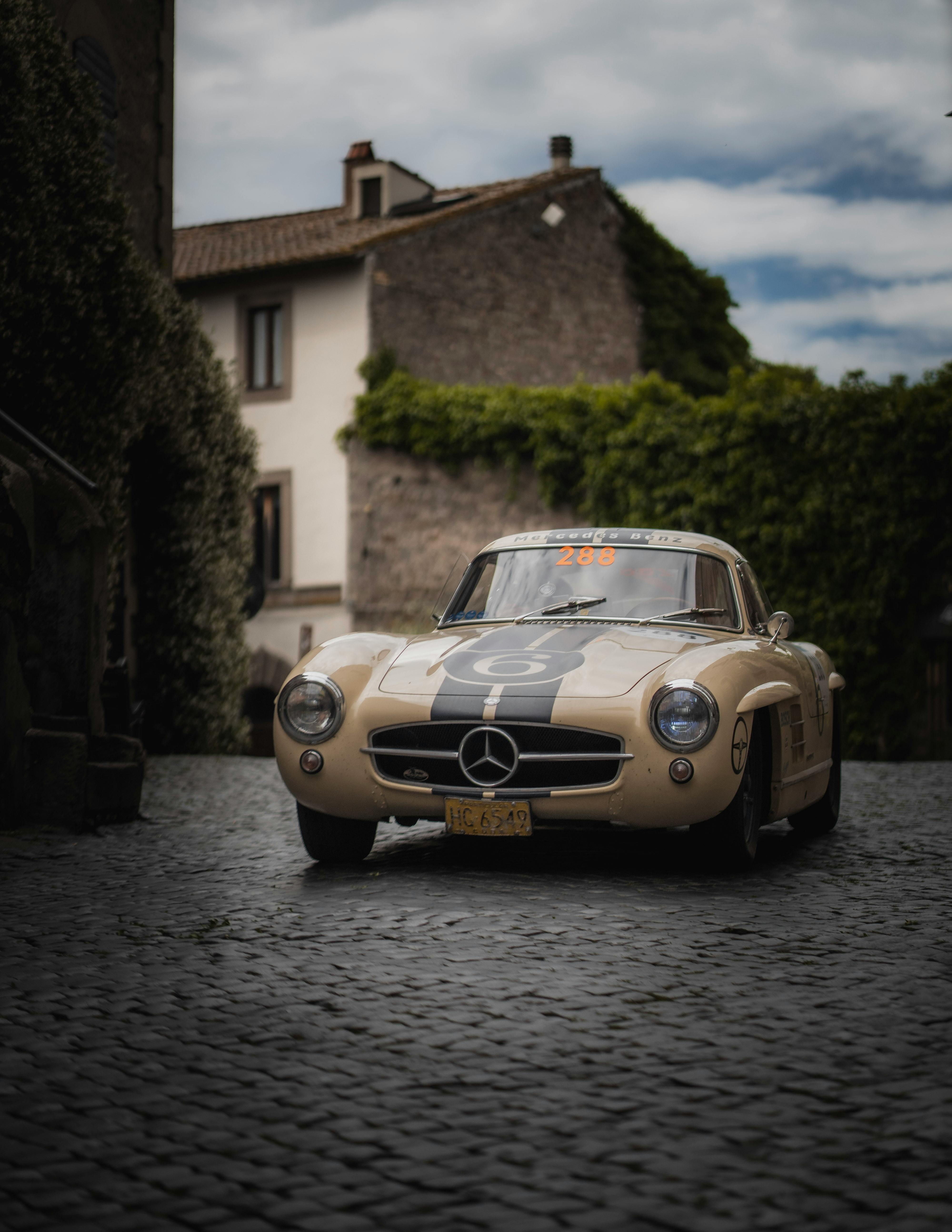 Vintage Mercedes-Benz Racing Car on Cobblestone Street · Free Stock Photo
