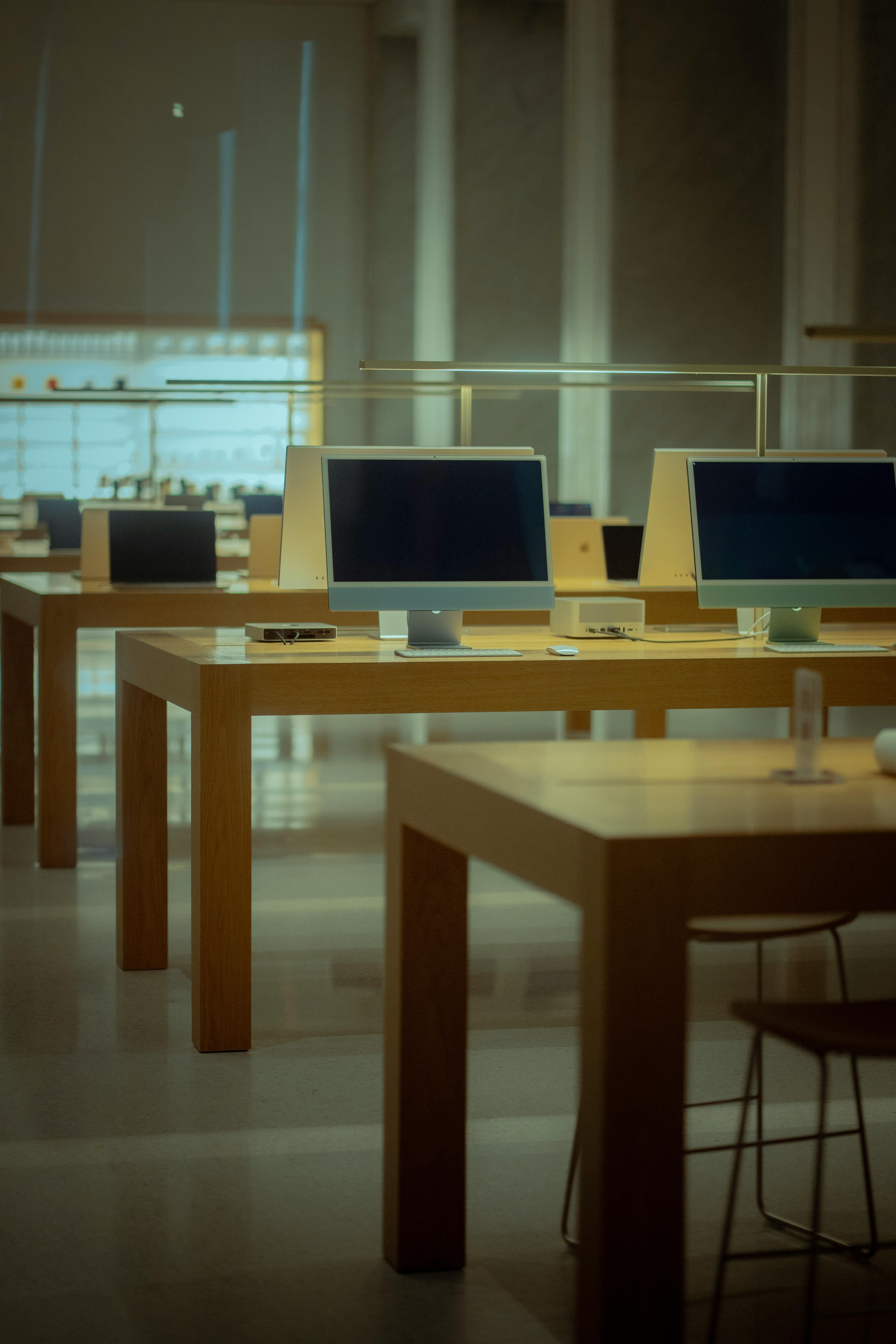 Modern Computer Store Interior with Desks · Free Stock Photo