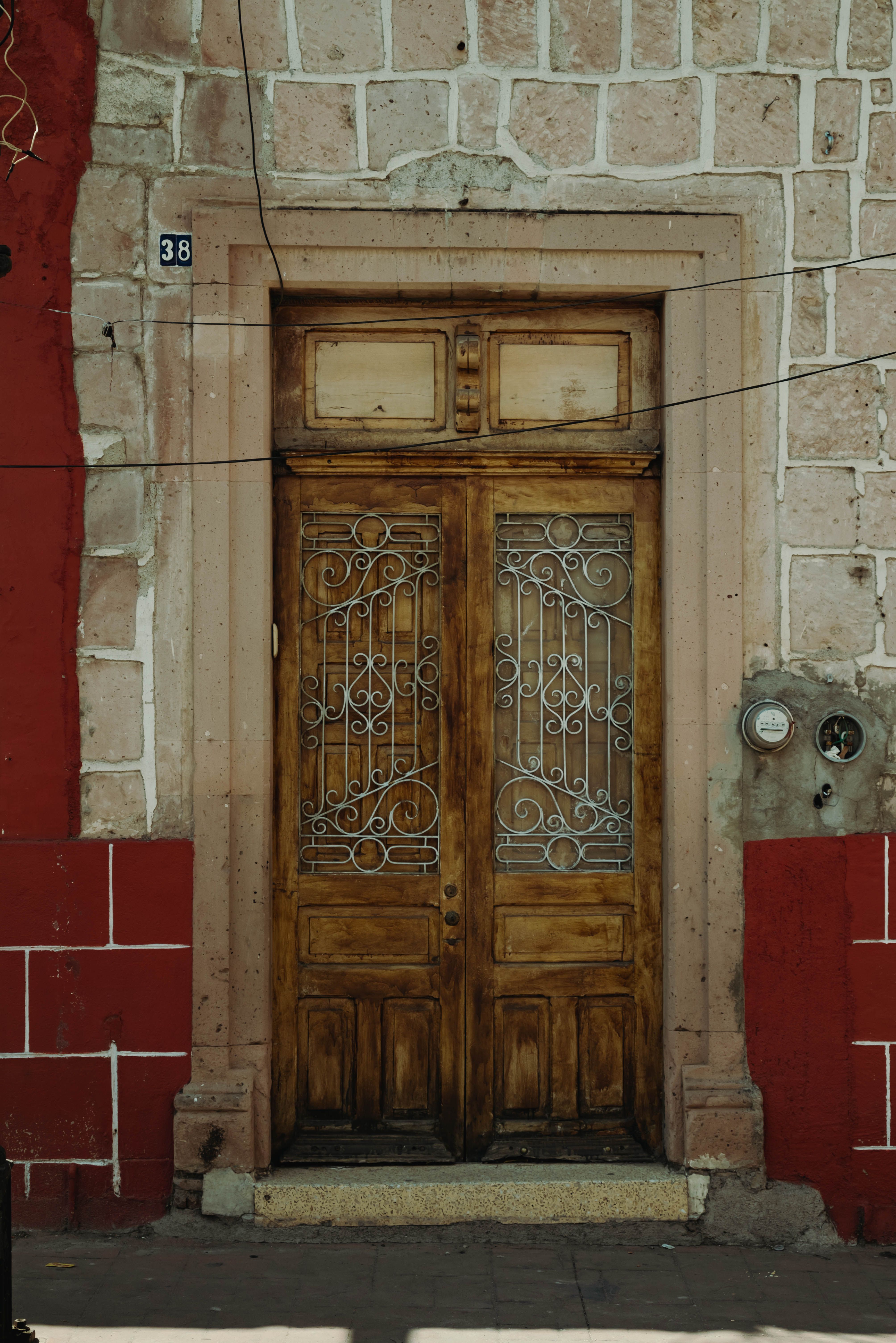 Rustic Wooden Door in Stone Wall Architecture · Free Stock Photo