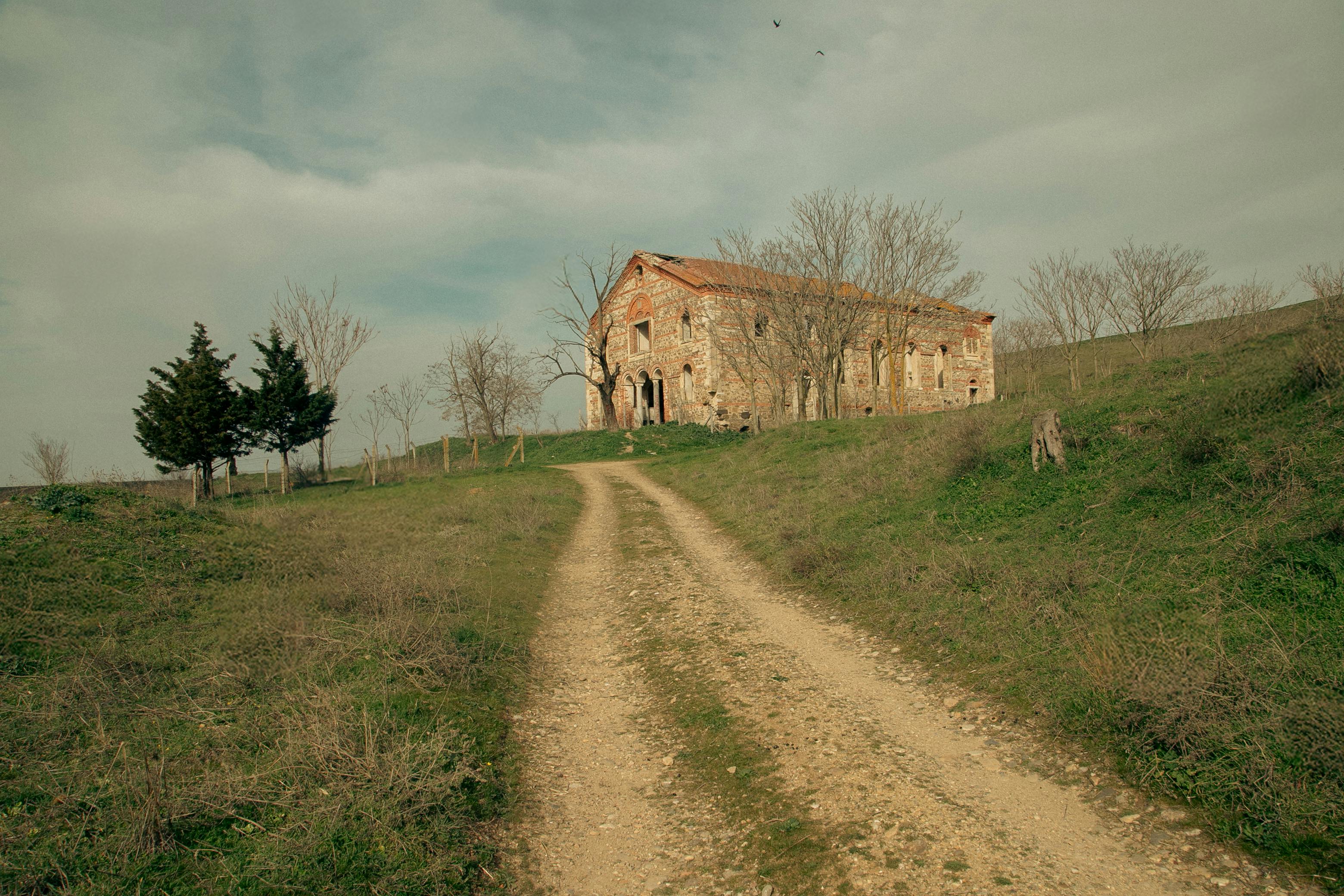 Abandoned Stone Building in Rural Landscape · Free Stock Photo