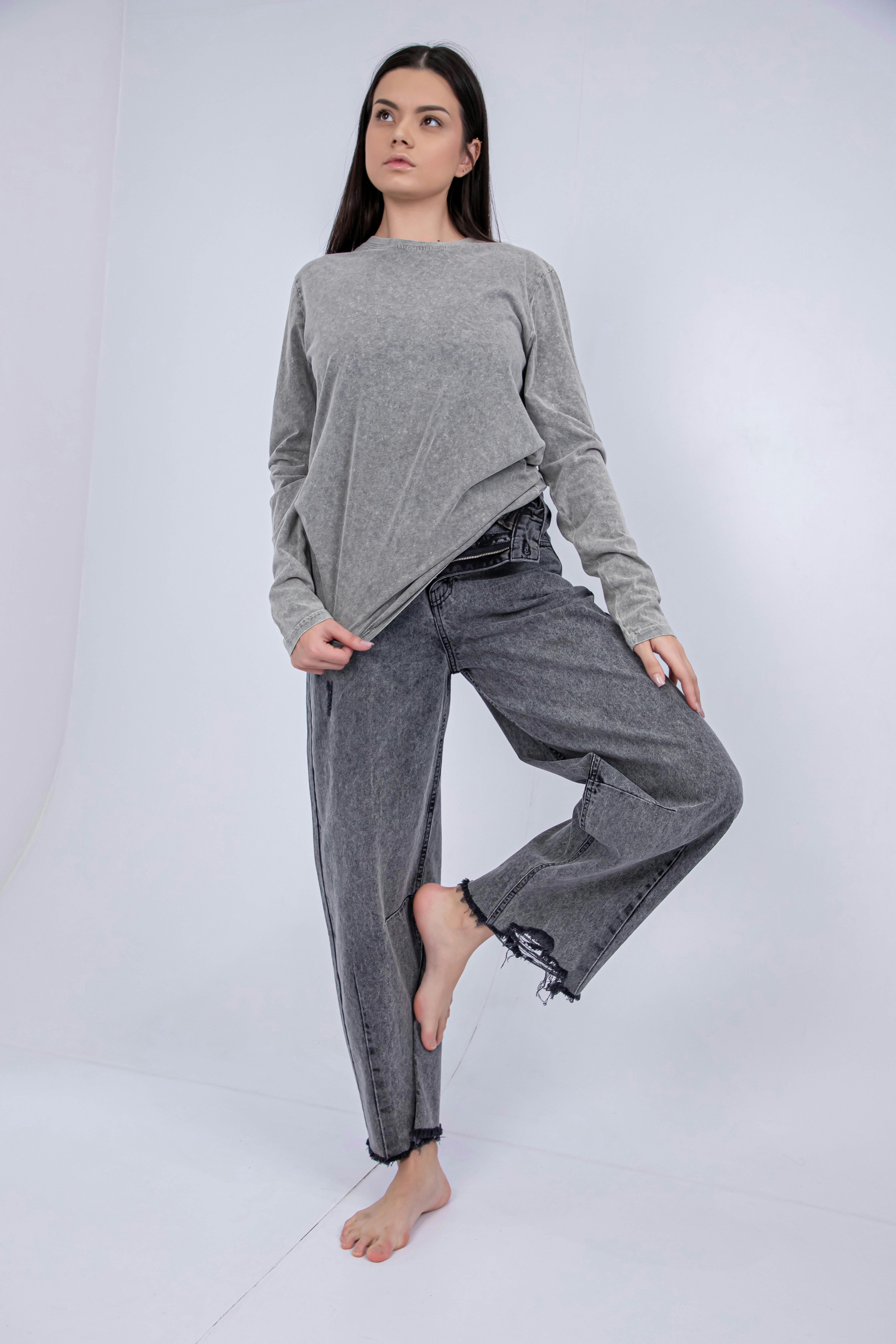 Barefoot Woman Posing in Casual Gray Outfit · Free Stock Photo