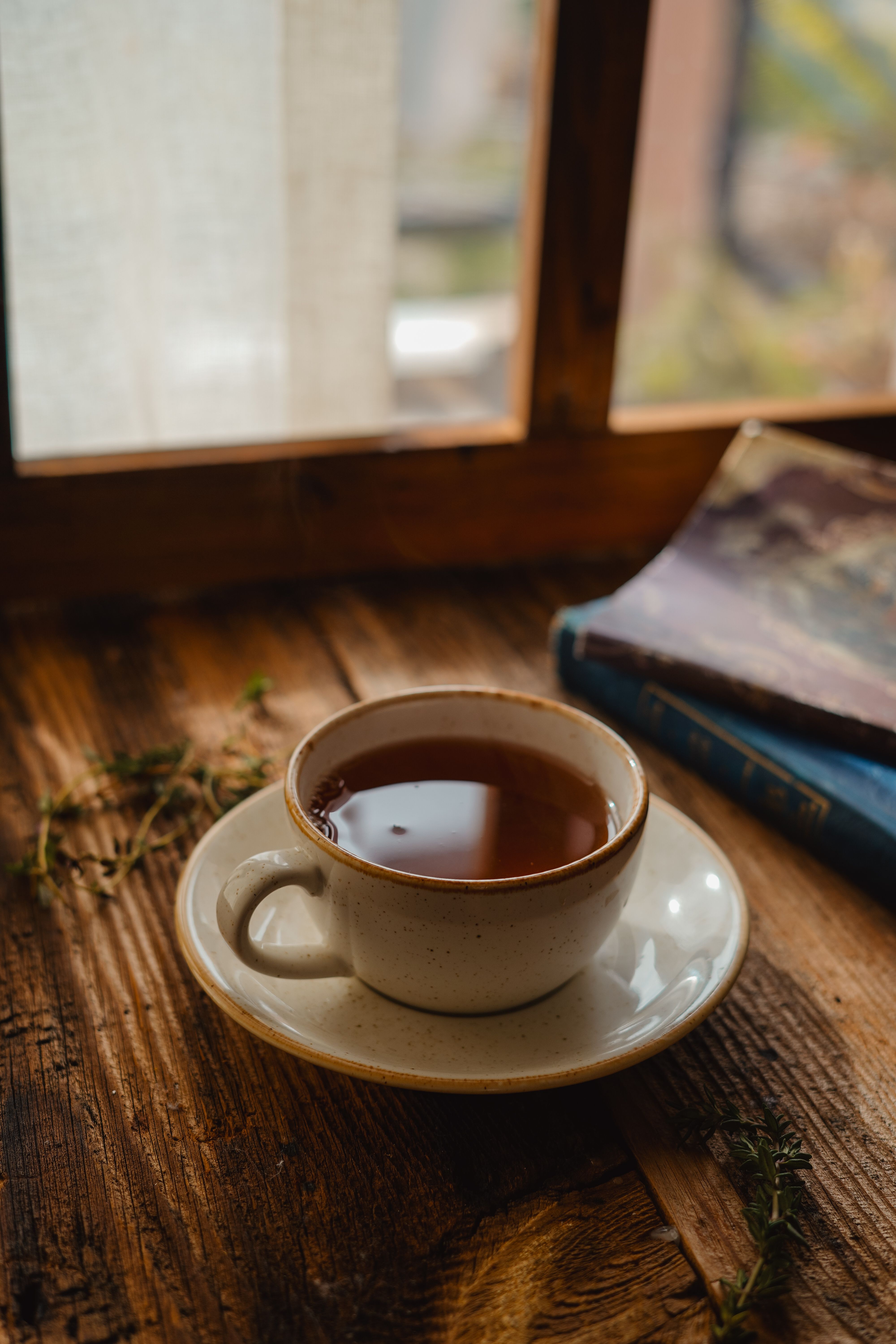 Cozy Cup of Tea by a Rustic Window · Free Stock Photo