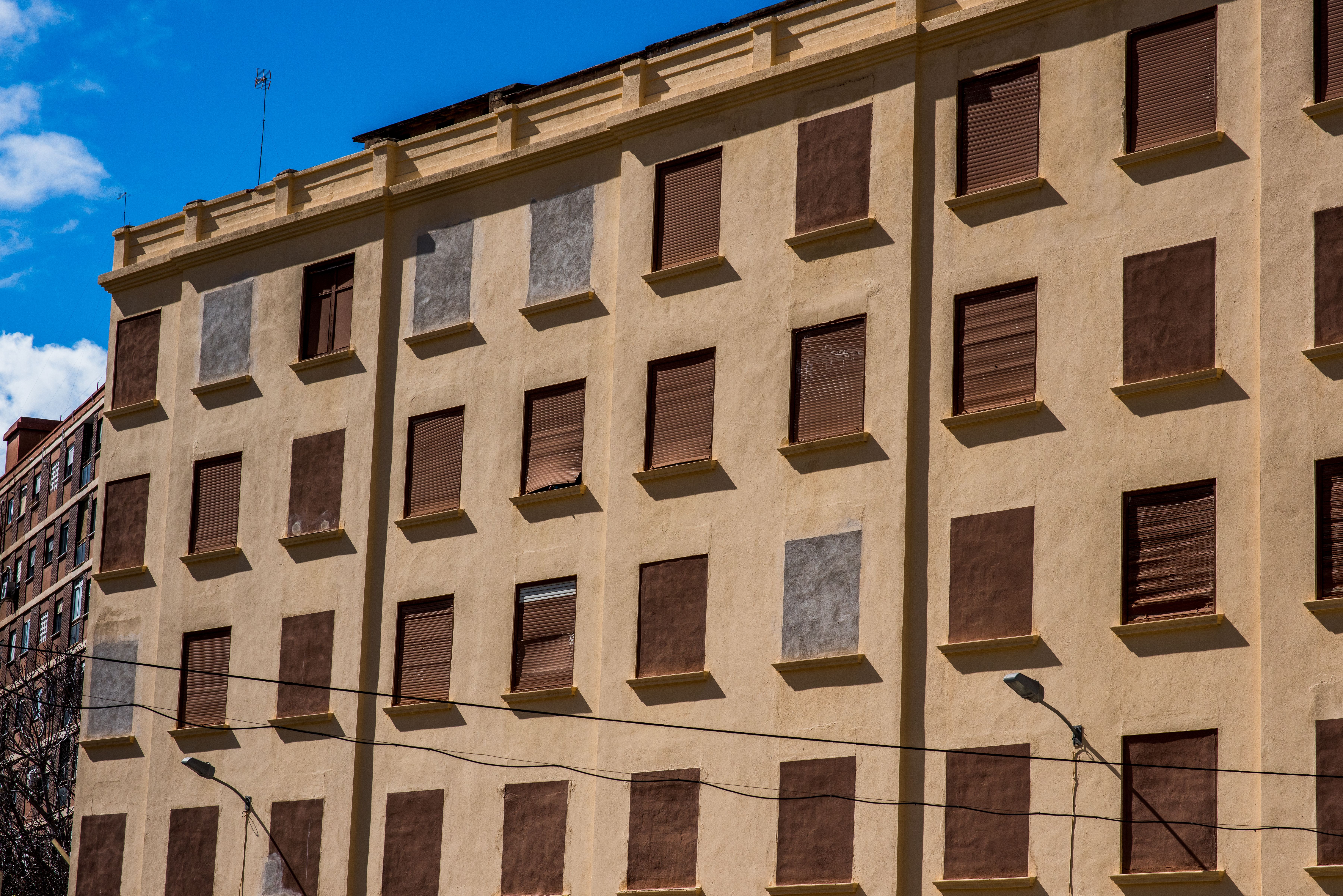 Urban Building Facade with Closed Windows · Free Stock Photo